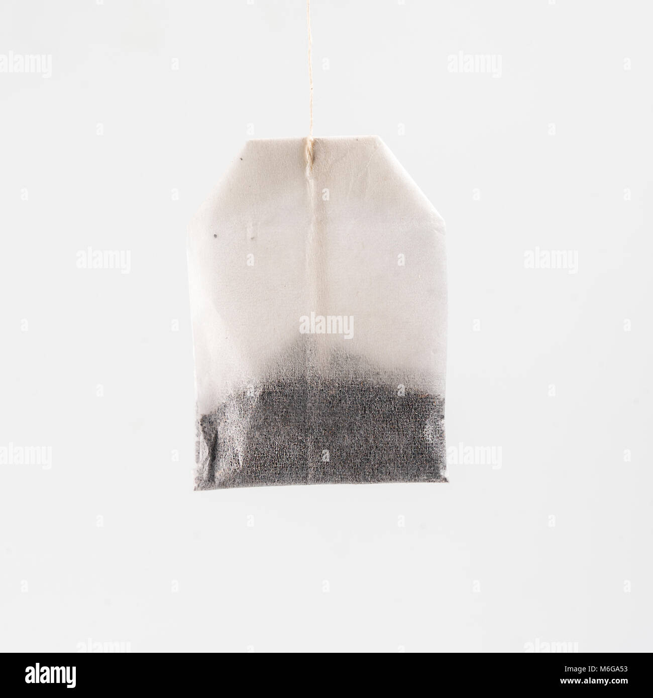 a tea bag on a white background Stock Photo - Alamy