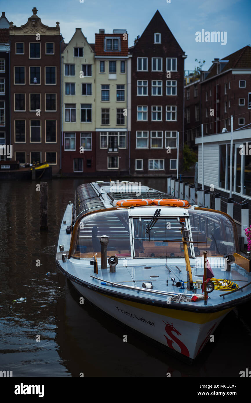 The canal tour boat in Amsterdam Stock Photo - Alamy