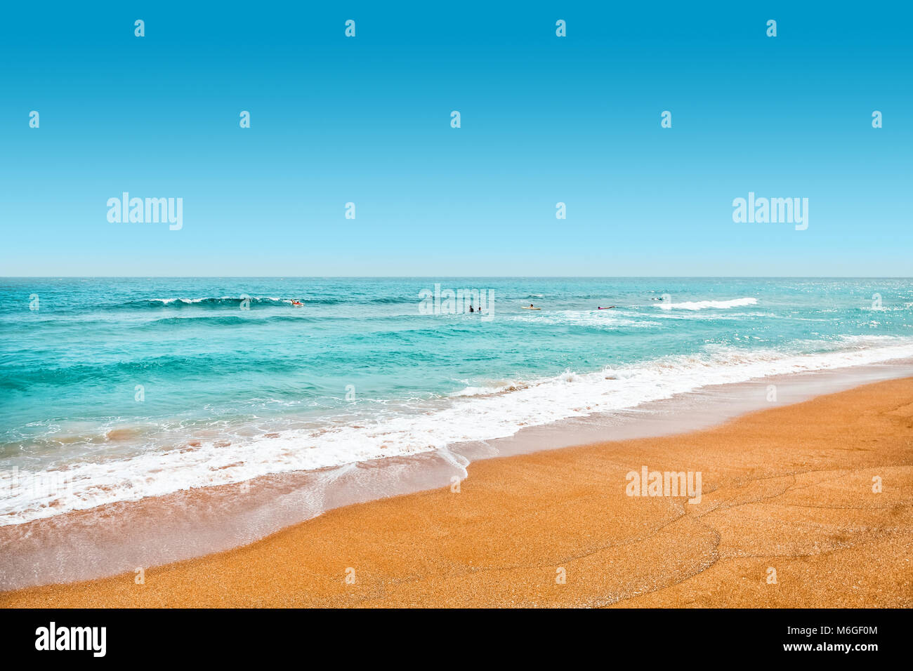 Yellow sand and turquoise color waters at swimming area of sea with ...