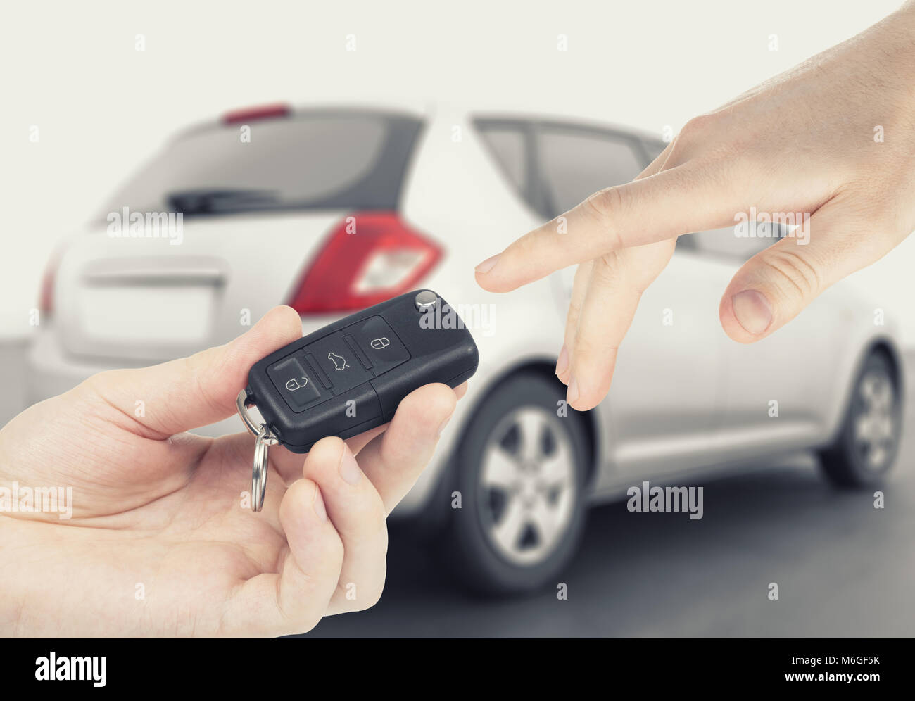 Hand giving key another hand hi-res stock photography and images - Alamy