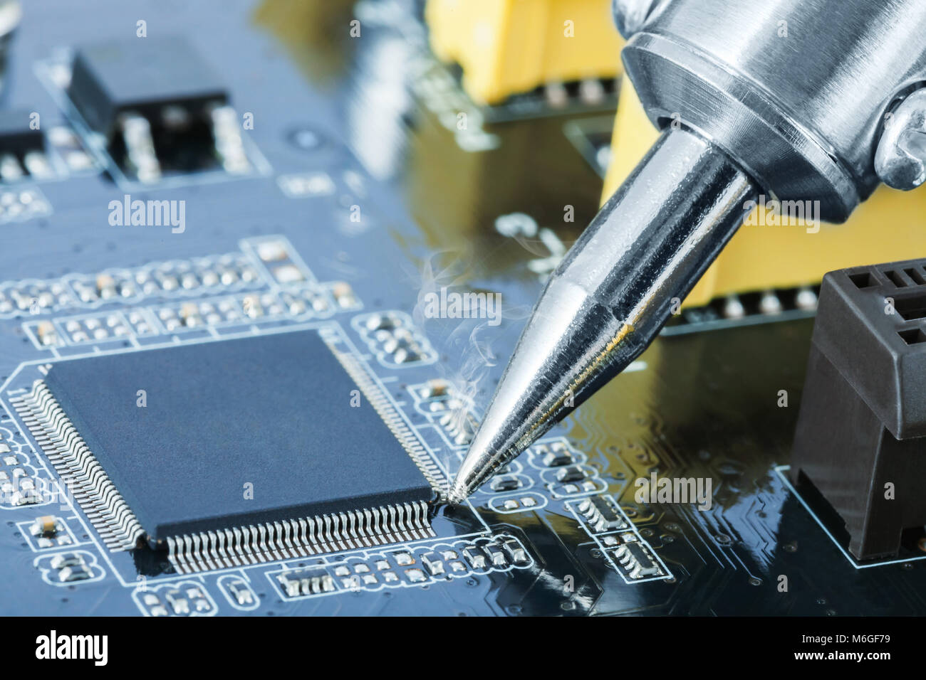 Electronic manufacturing and repair concept - close up shot of ...