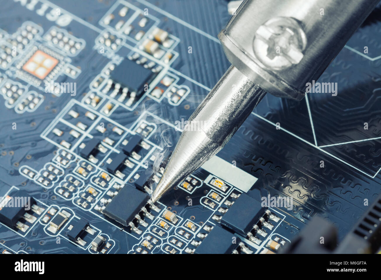 Electronic manufacturing and repair concept - close up studio shot of ...