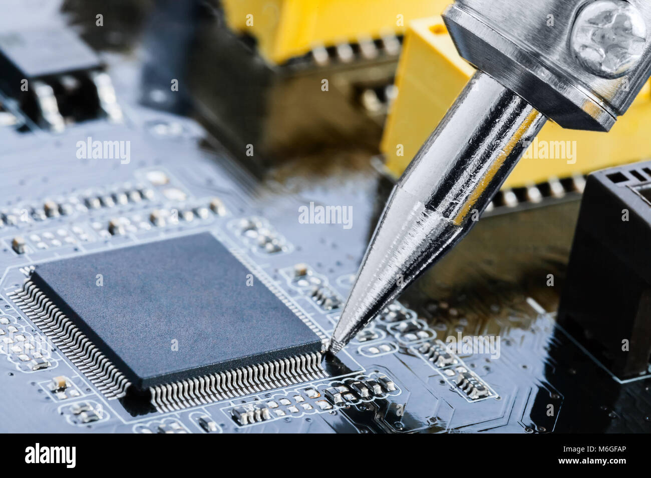 Electronic manufacturing and repair concept - soldering iron fixing ...