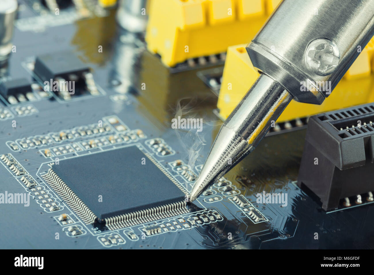 Electronic manufacturing and repair concept - soldering iron and ...