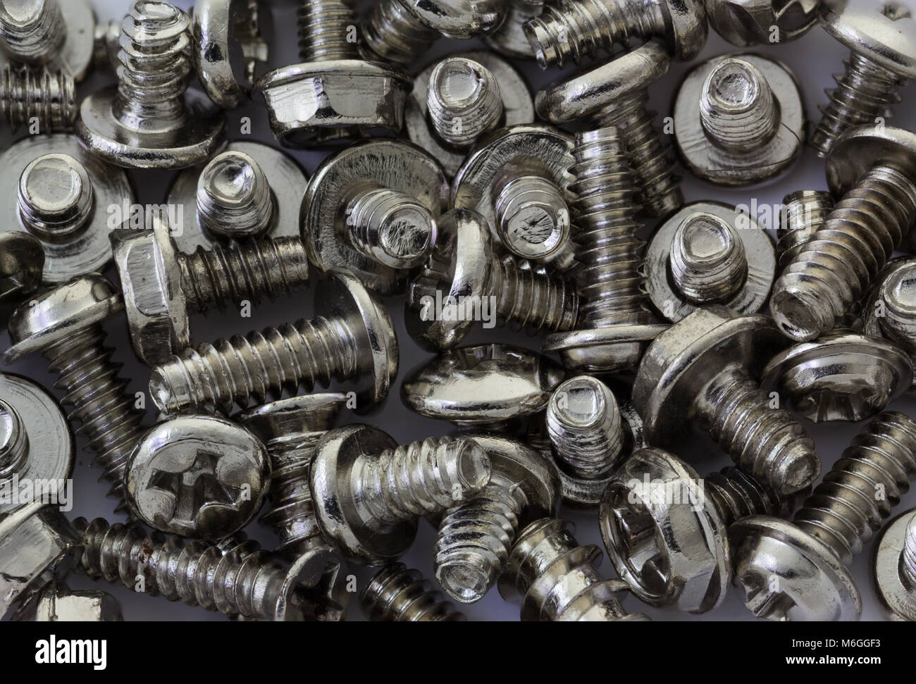 Industrial background of new metalic screws Stock Photo - Alamy