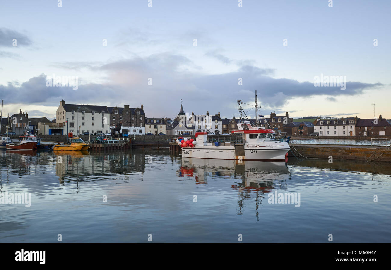 Fishing Boats moored against the Quayside of the Inner harbour of ...