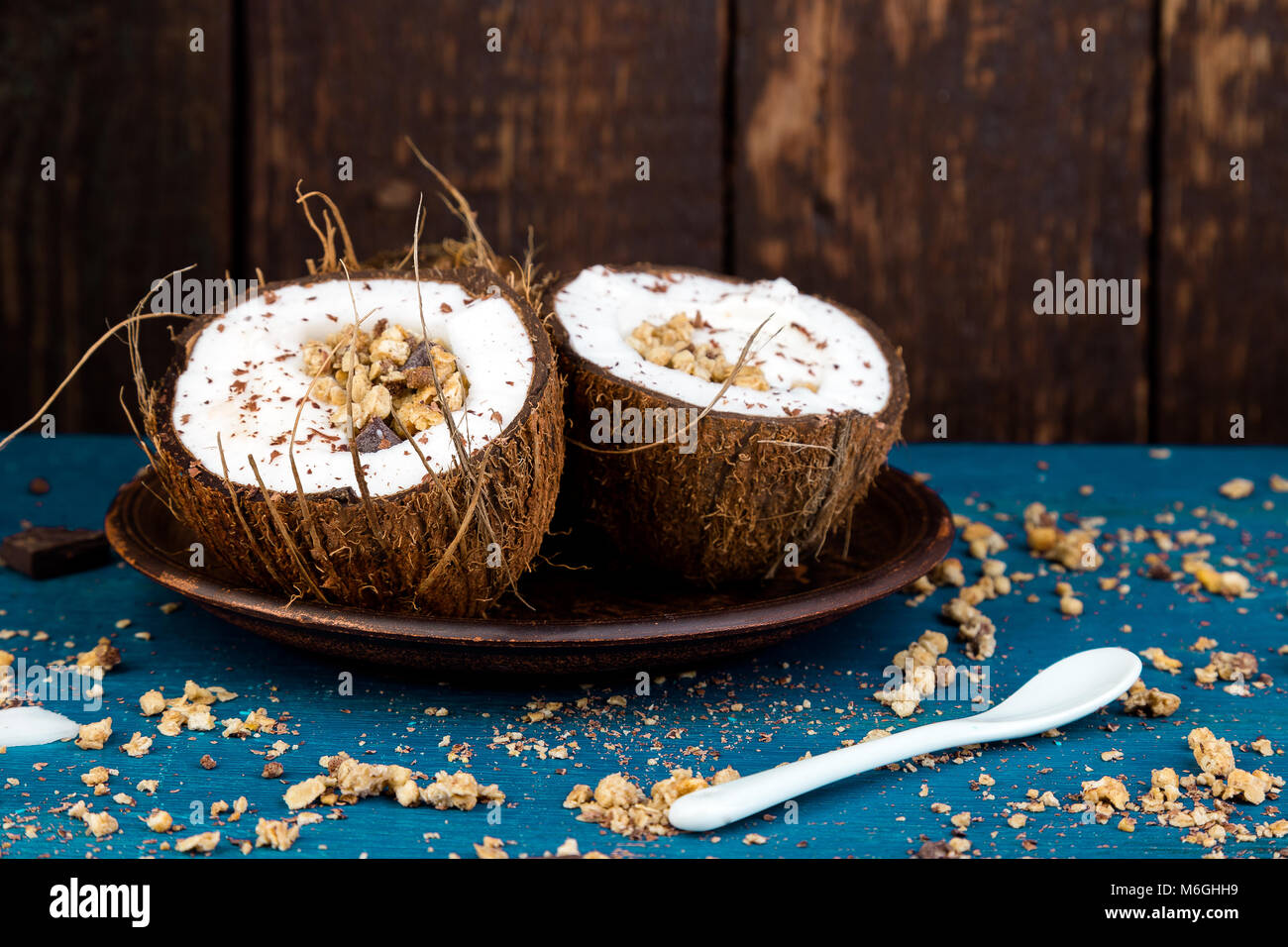 Healthy breakfast in coconut bowl. Yogurt in coconut bowl with coconut ...