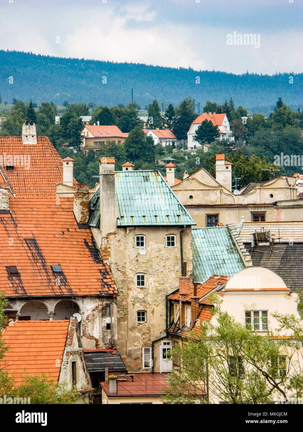 Historic European buildings with weathered facades and tiled roofs on ...