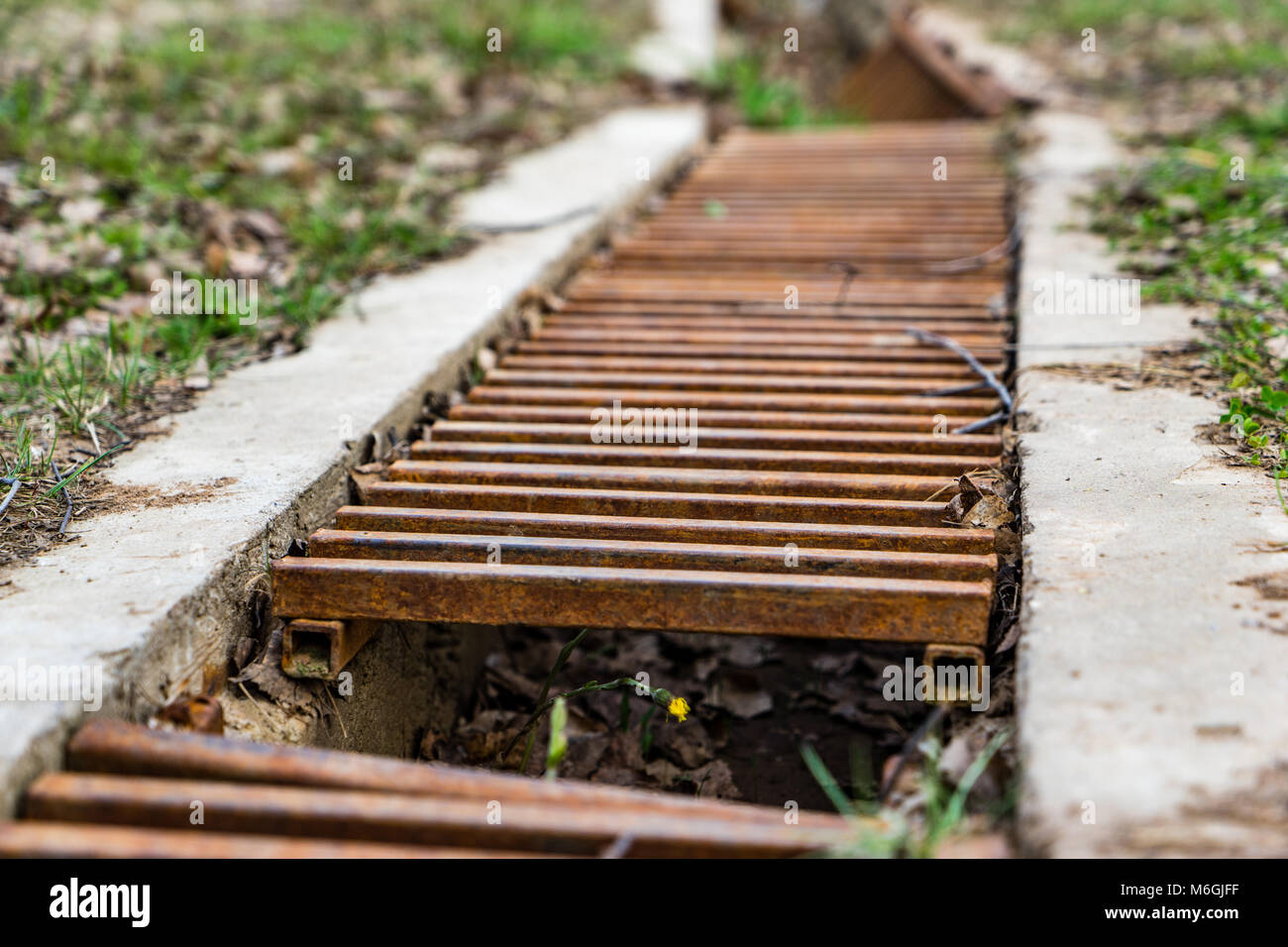 Drainage with rusty bars Stock Photo - Alamy
