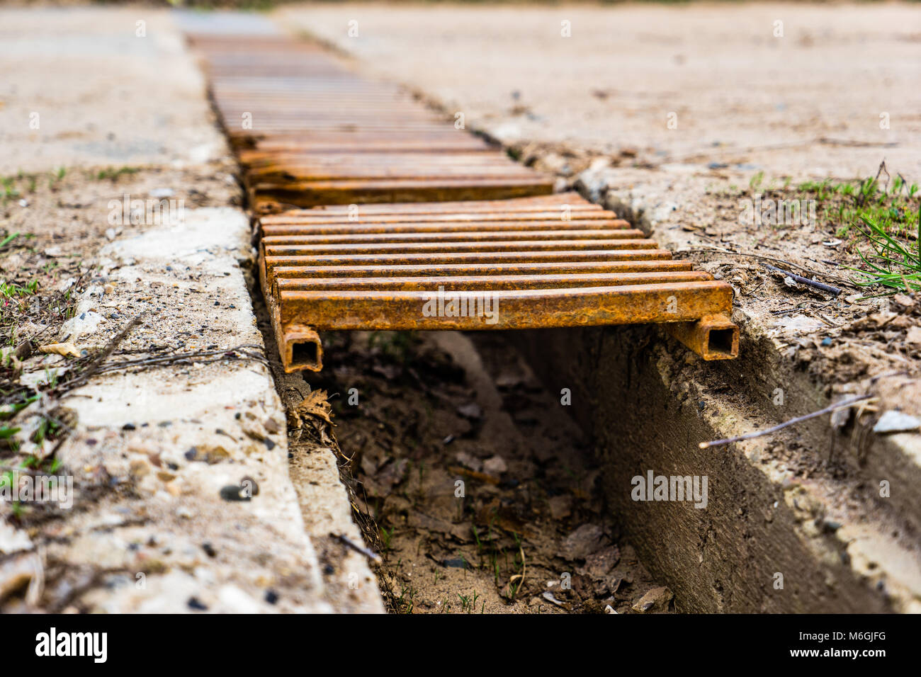 Drainage with rusty bars Stock Photo - Alamy