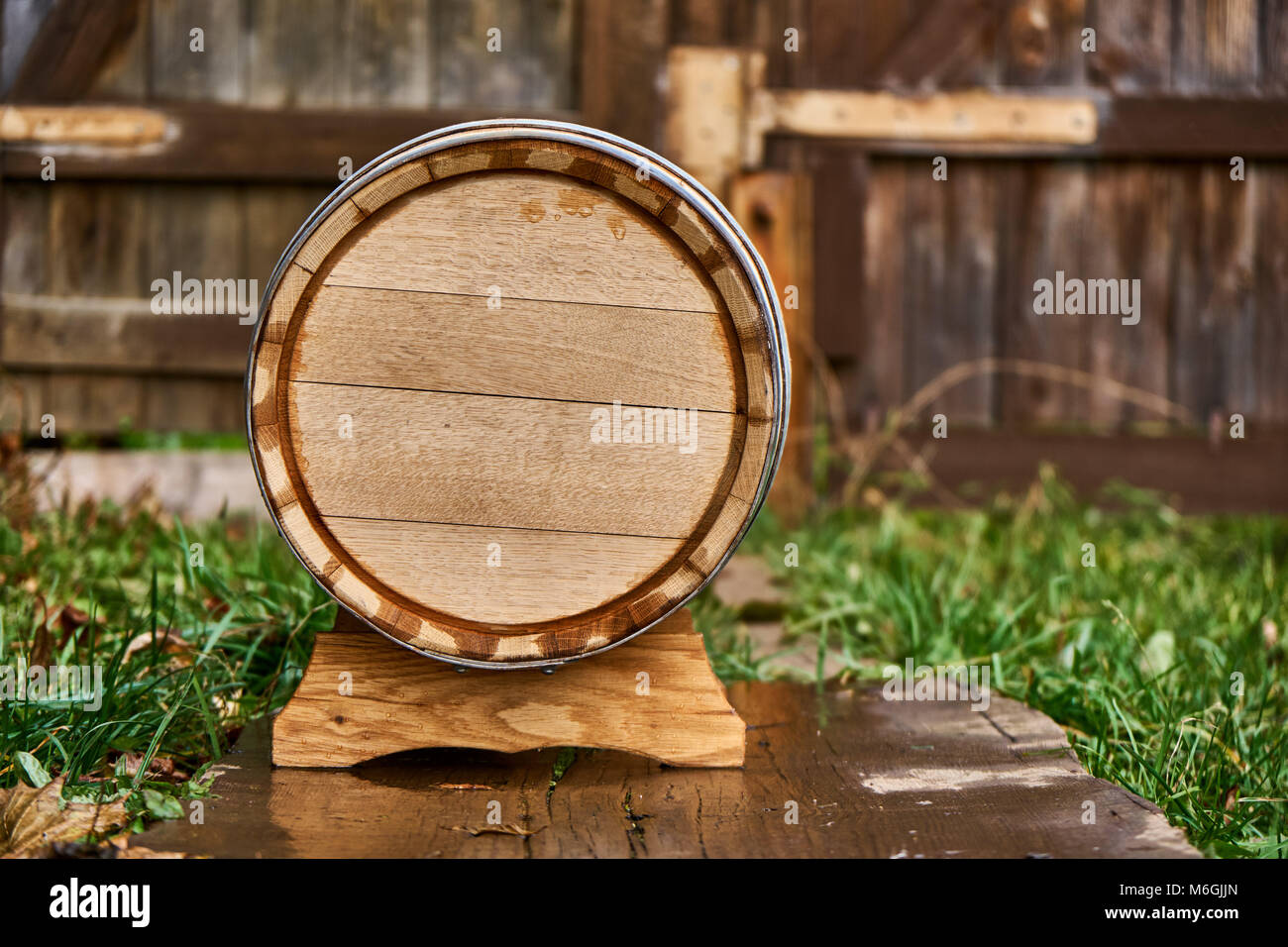 Old oak barrel for storing wine stands on a special stand during ...