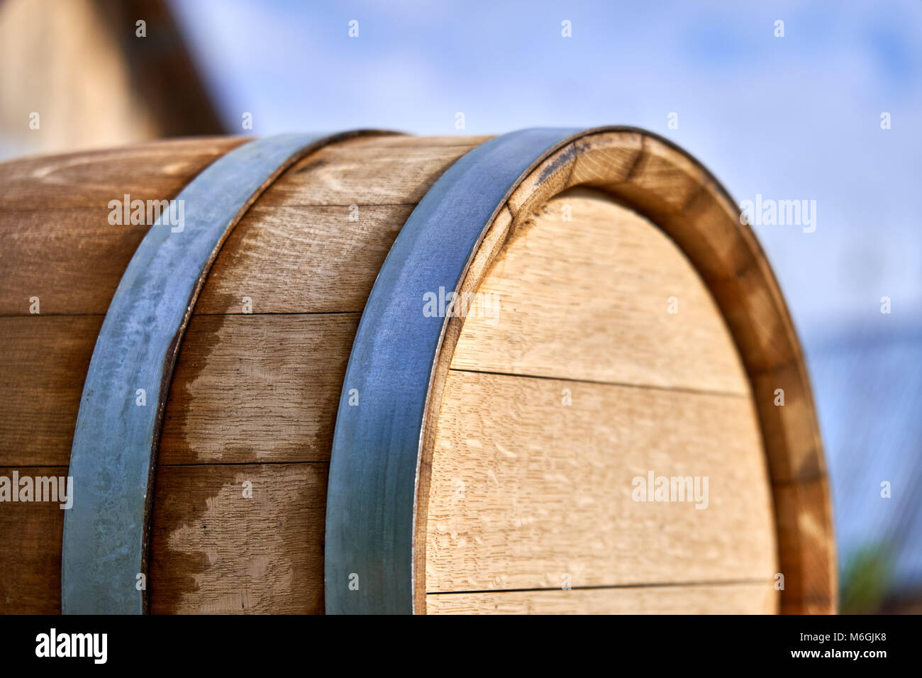 Old oak barrel for storing wine stands on a special stand in the ...