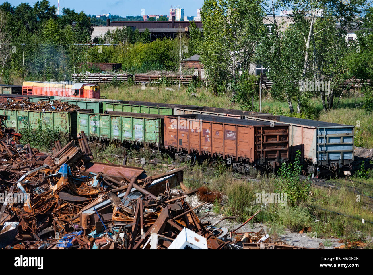 Freight railroad train carrying scrap metal at a metallurgical plant ...