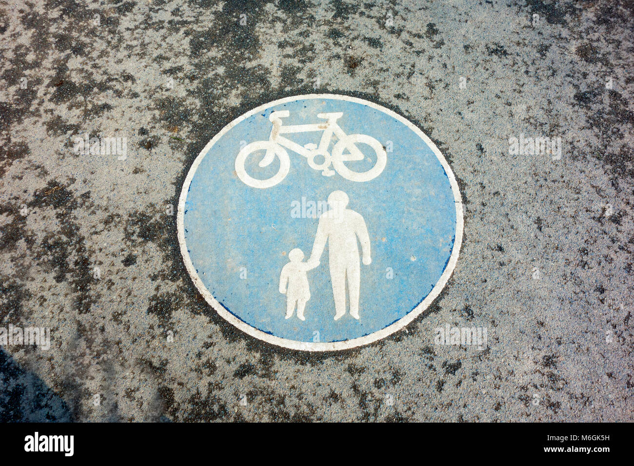 Sign on a shared use footpath showing both pedestrians and people ...