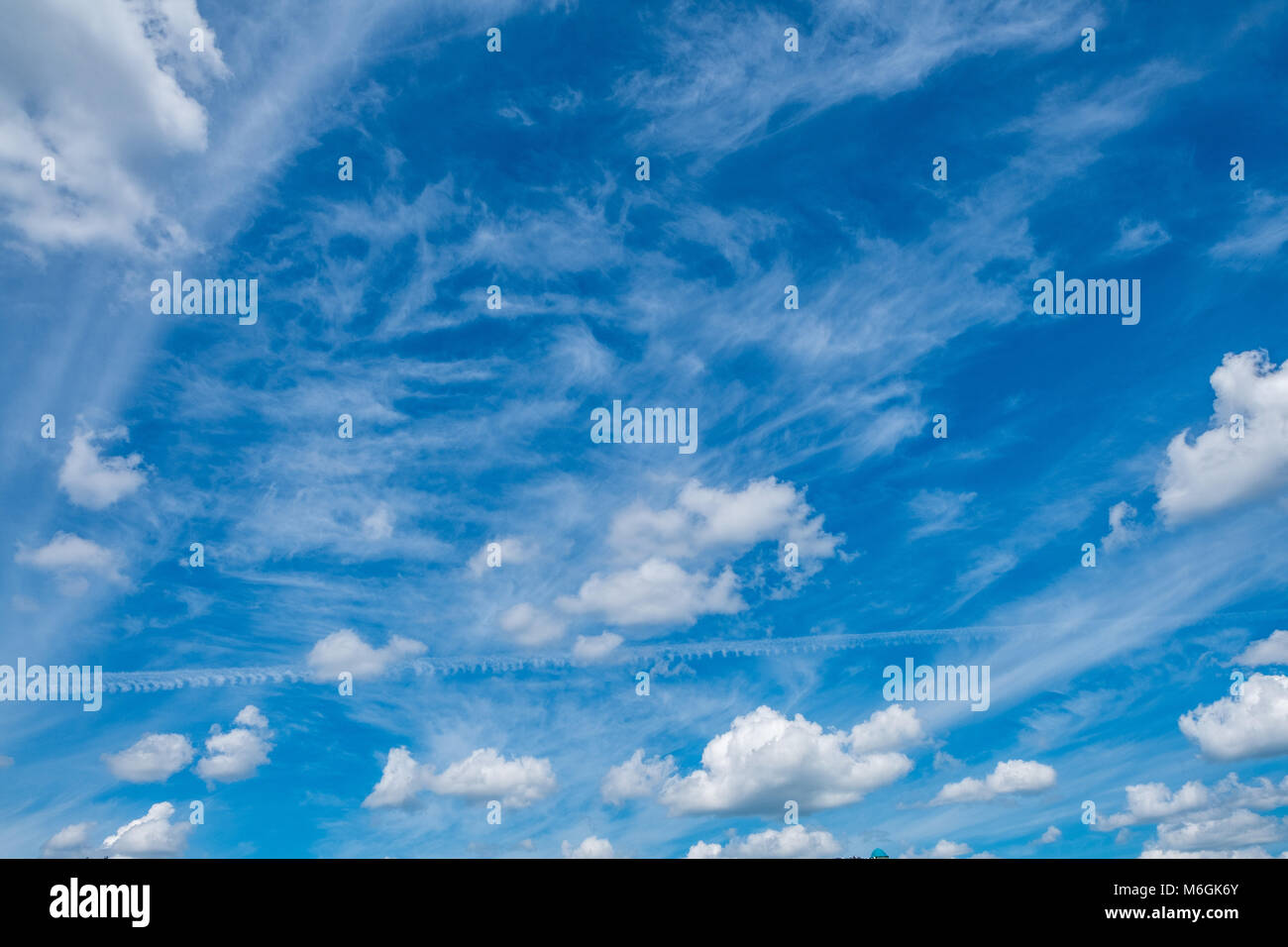 Blue sky containing different types of cirrus and cumulus clouds as ...
