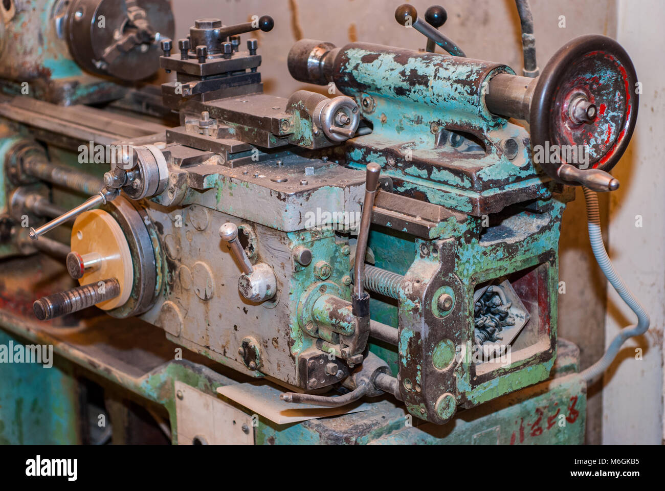 Old metal lathe machine for metalworking in workshop closeup view Stock ...