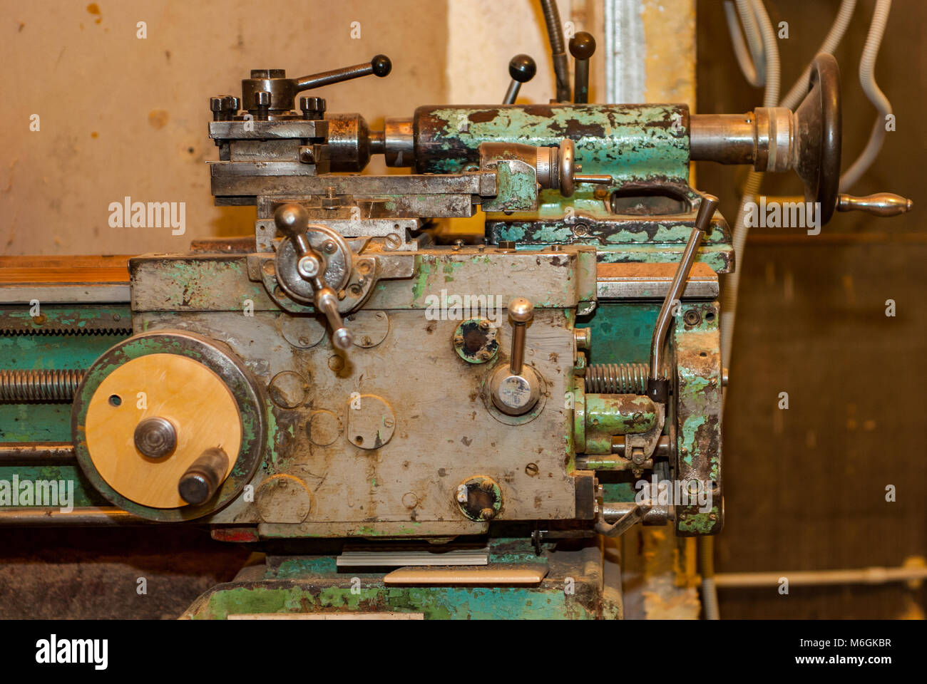 Old metal lathe machine for metalworking in workshop closeup view Stock ...