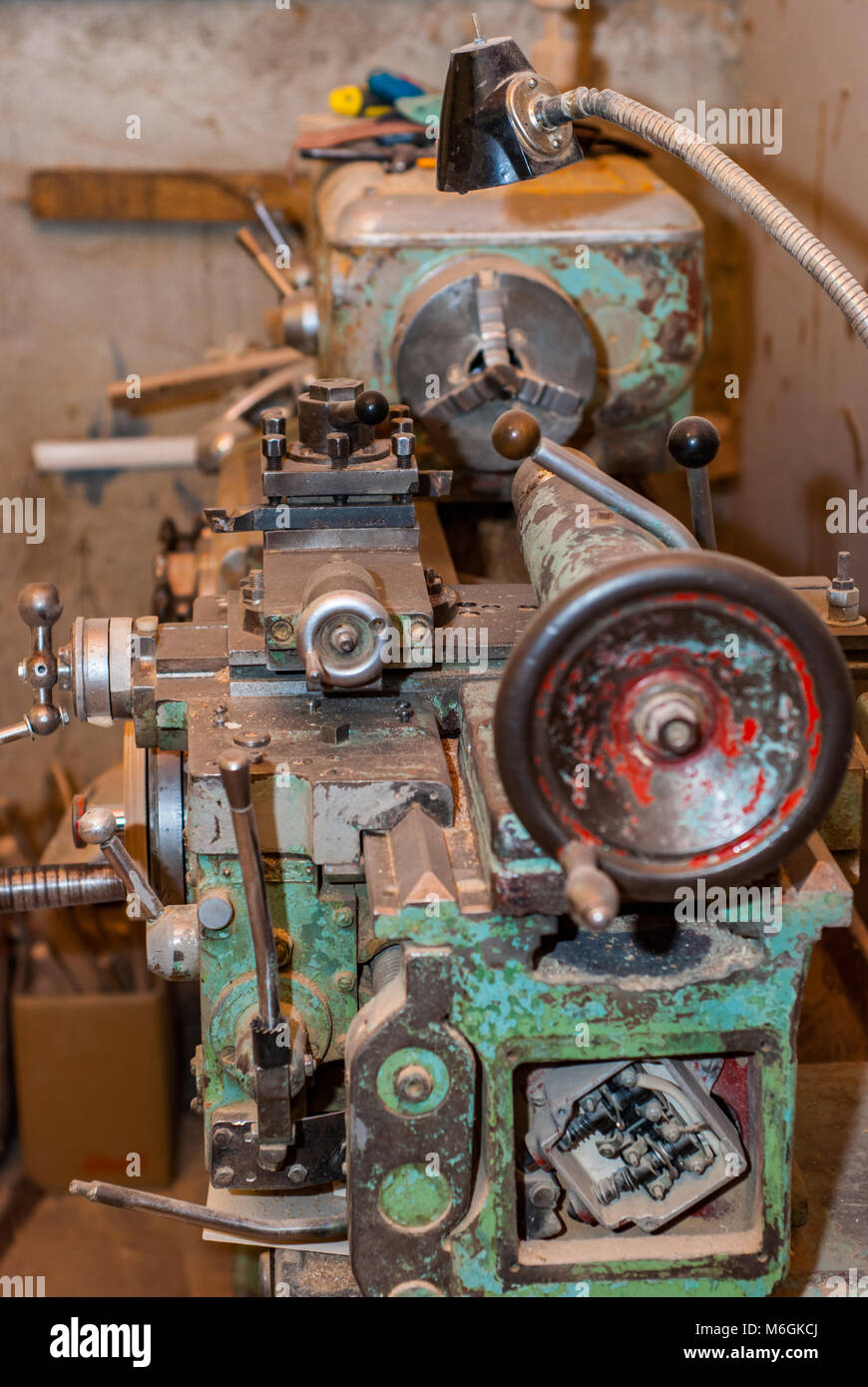 Old metal lathe machine for metalworking in workshop closeup view Stock ...