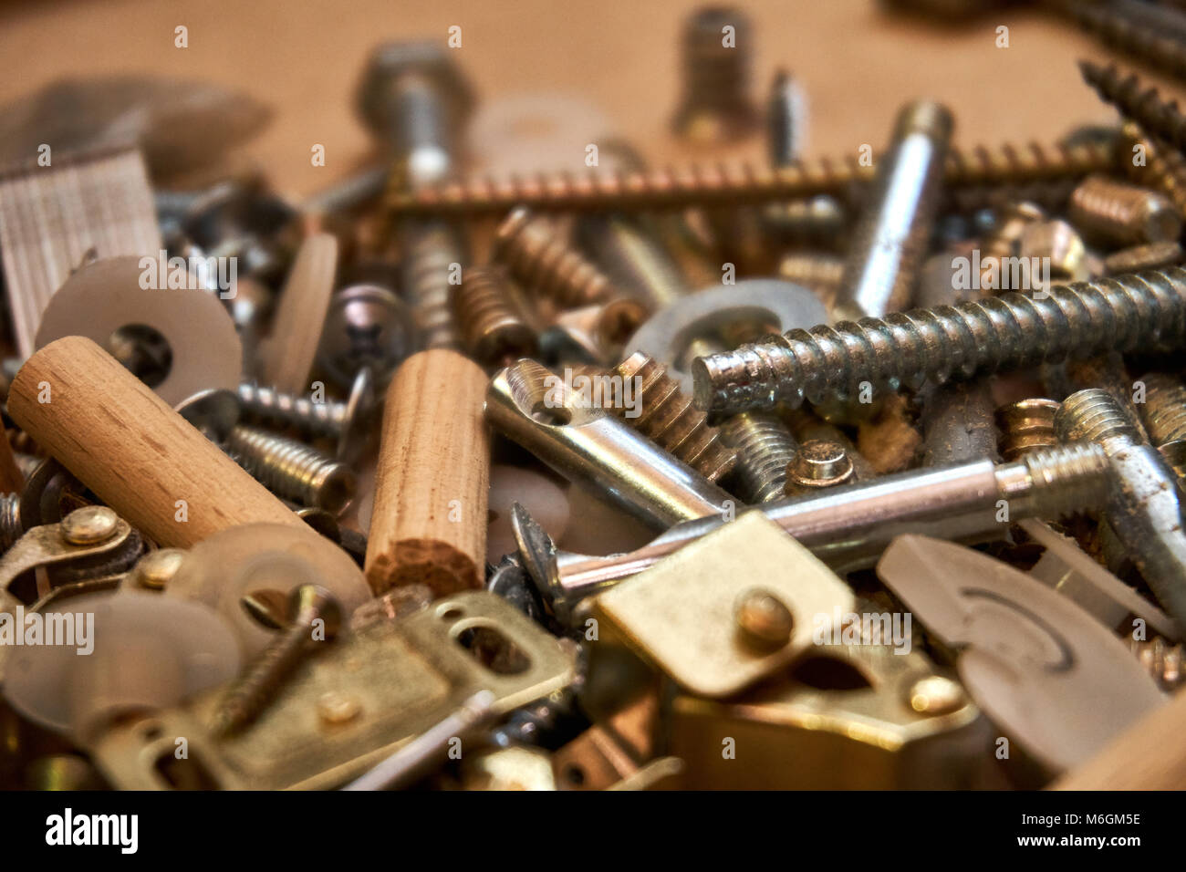 Close up view of variety of screws, nails, bolts, and other hardware ...
