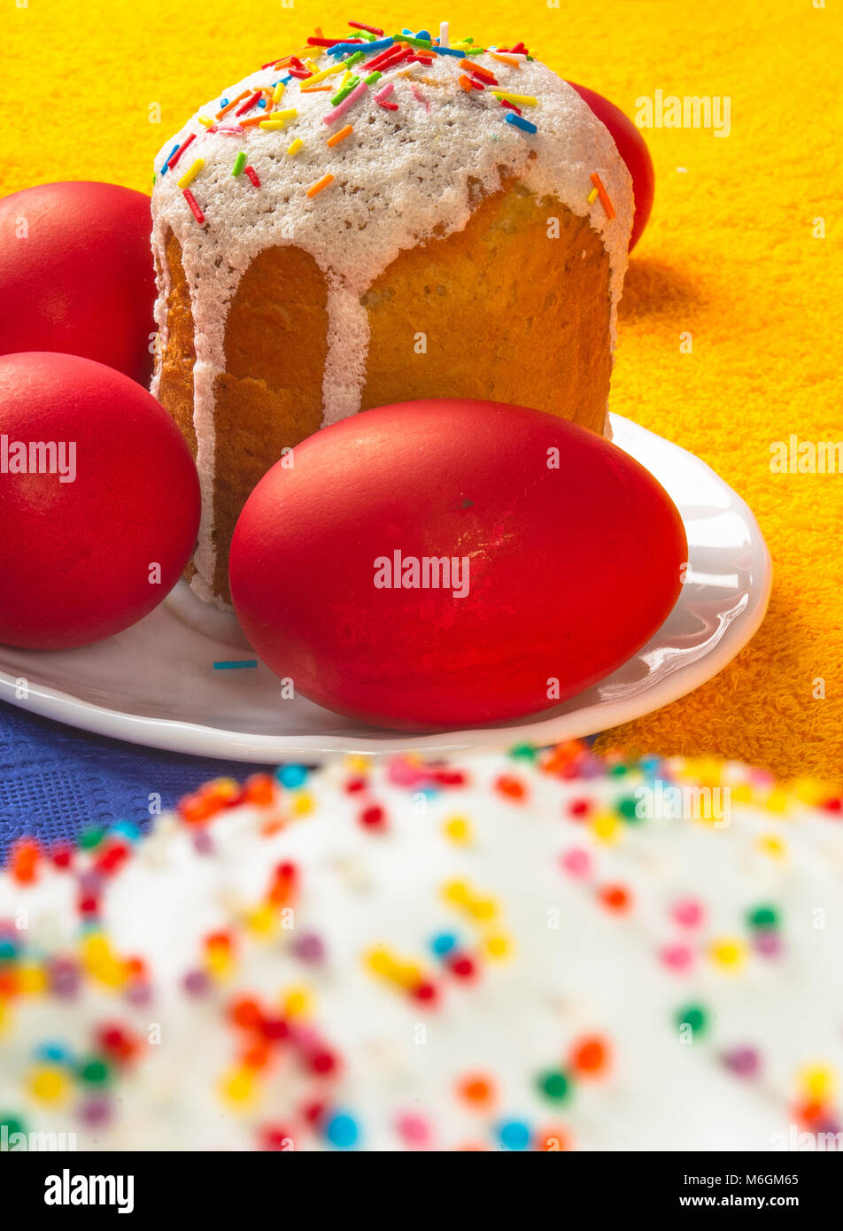 Kulichi, traditional Russian Easter cake with icing and dyed eggs Stock ...