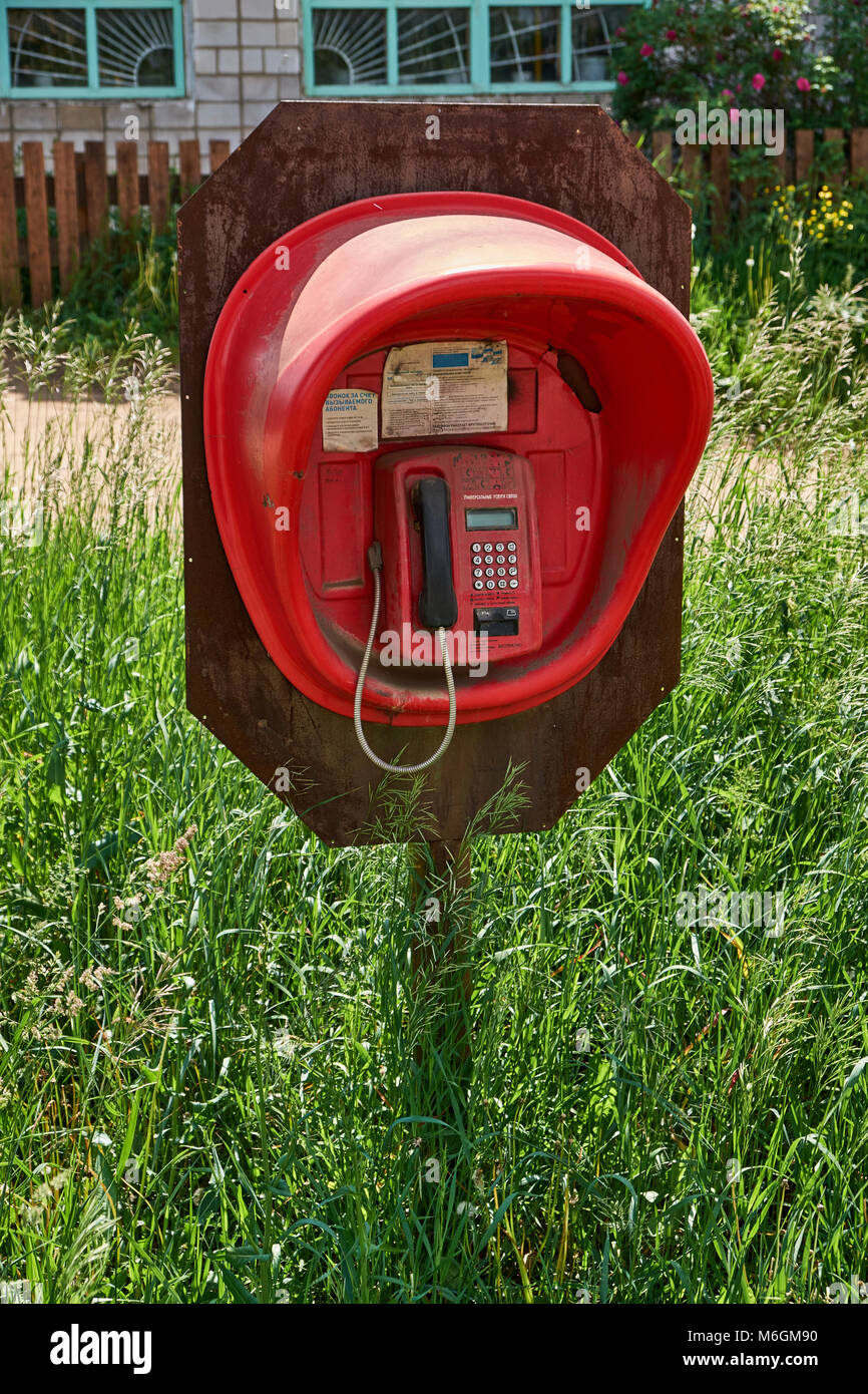 Red telephone booth for emergency calls in countryside Stock Photo - Alamy