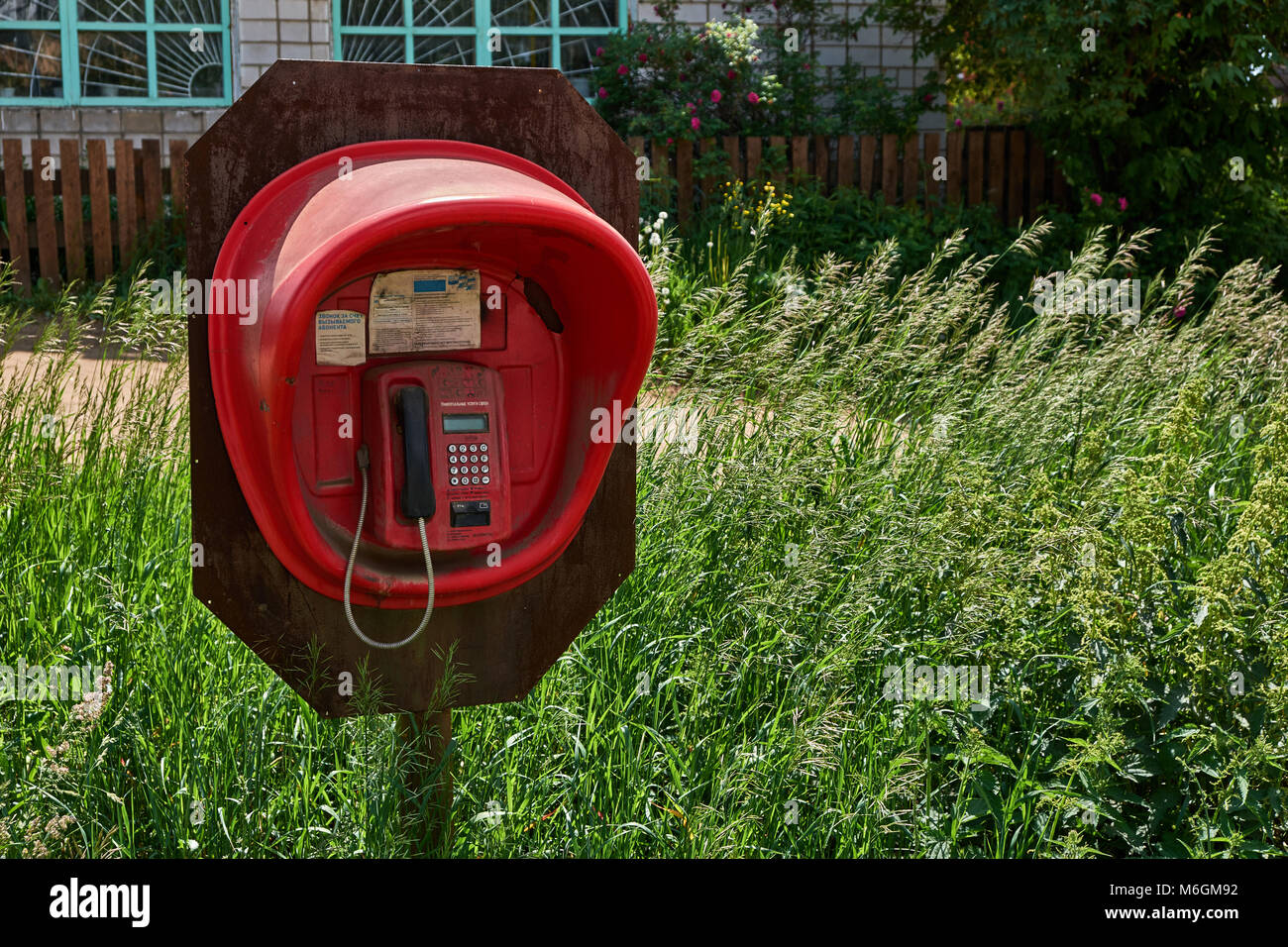 Red telephone booth for emergency calls in countryside Stock Photo - Alamy