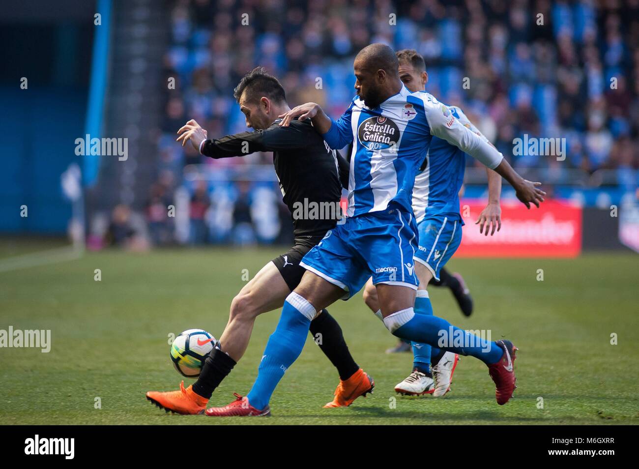 sidnei of deportivo and charles of eibar in action during Santander ...