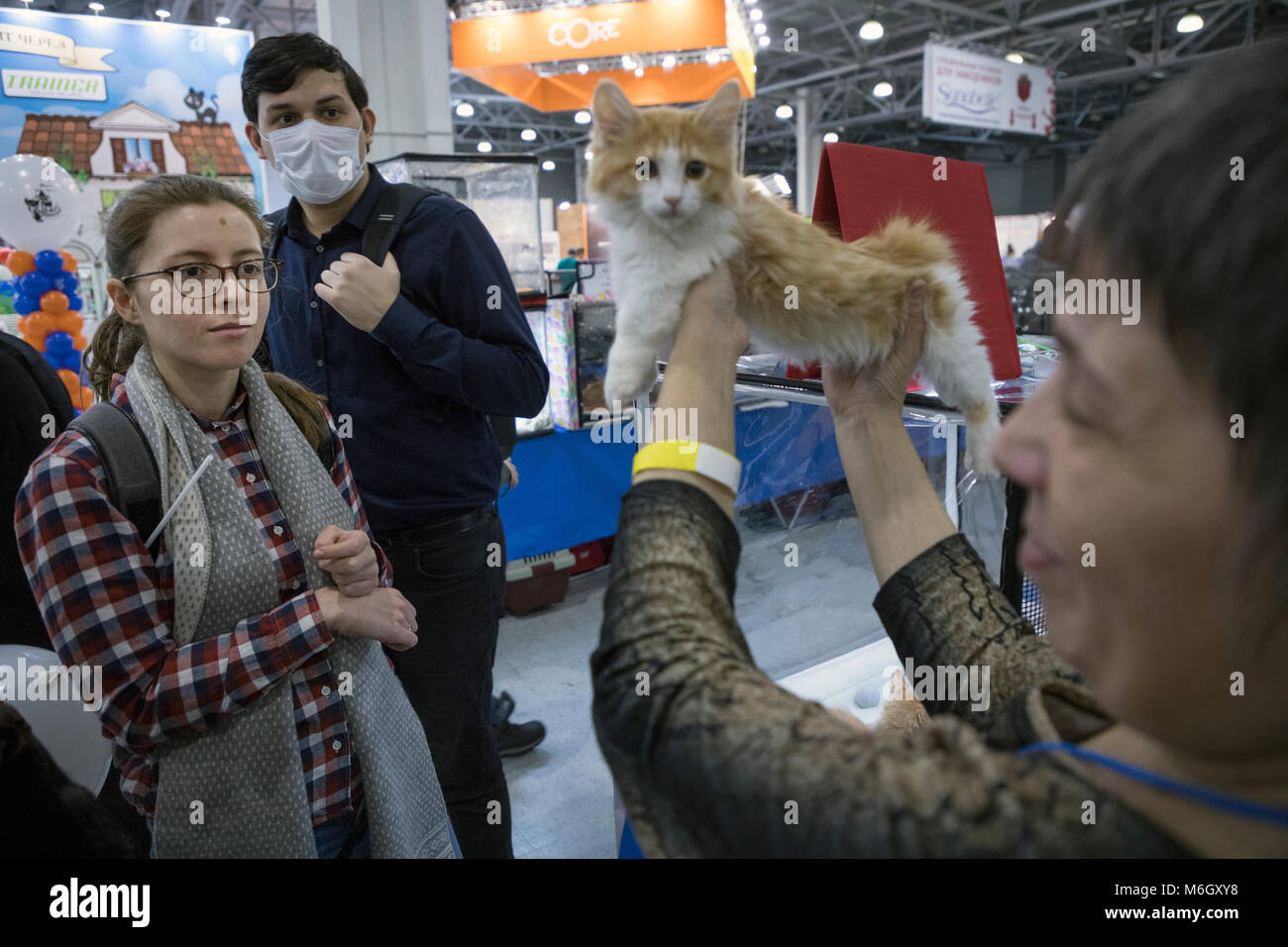 Moscow, Russia. 4th March, 2018. Visitors choose a cat at the Catsburg ...
