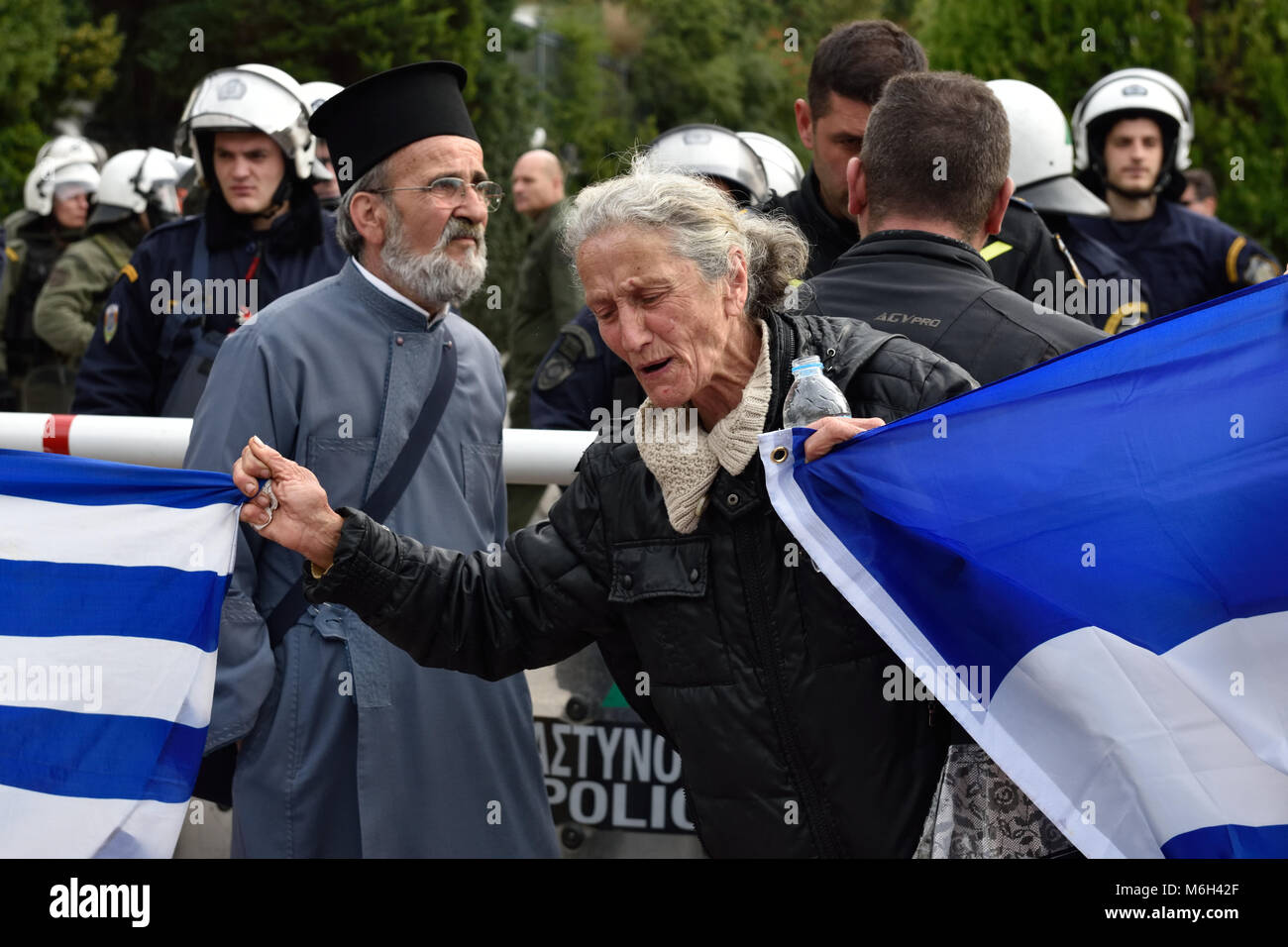 Athens, Greece, 4th March, 2018. A woman chants slogans standing in ...