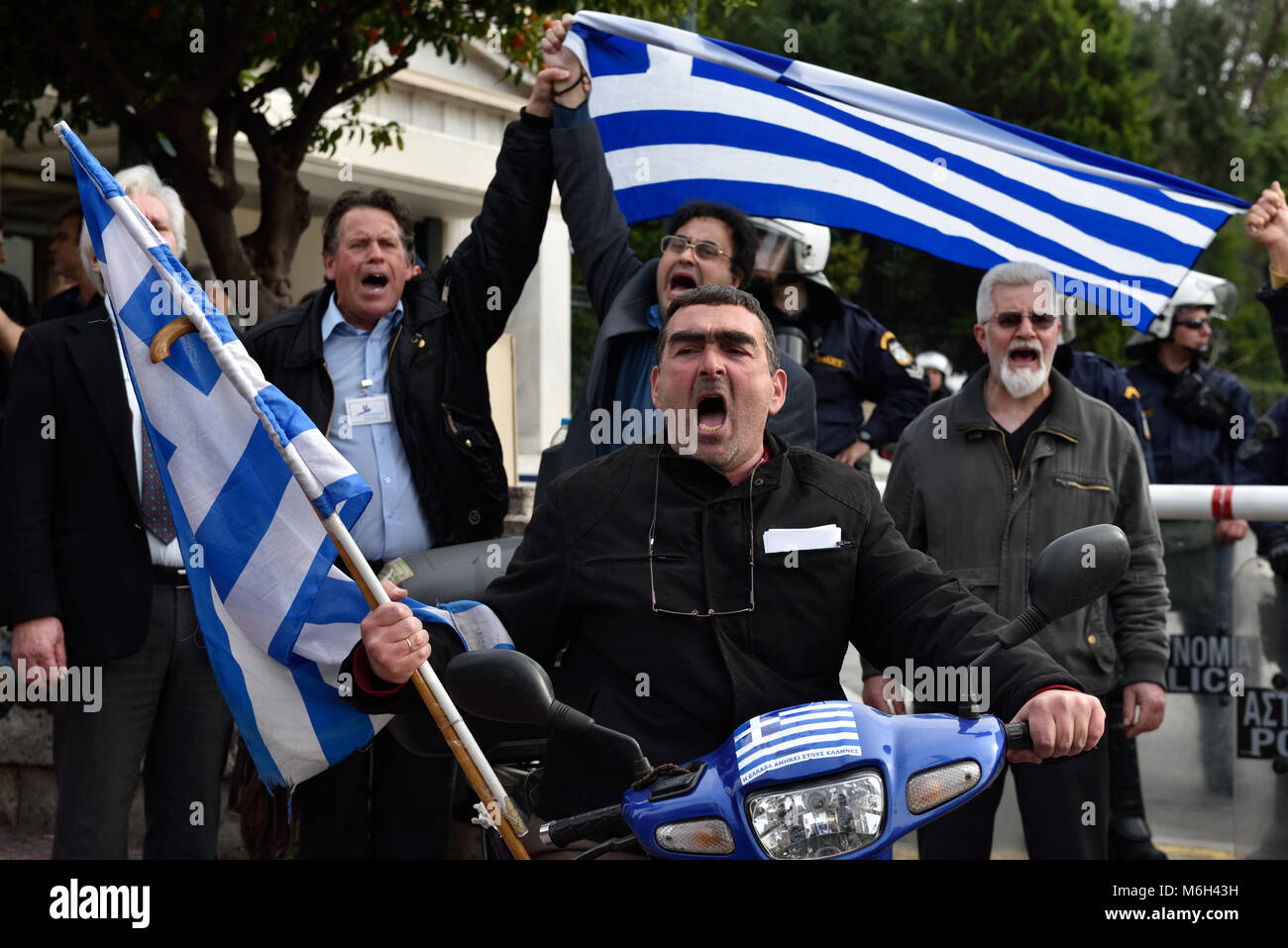 Athens, Greece, 4th March, 2018. Protesters wave Greek flags and chant ...