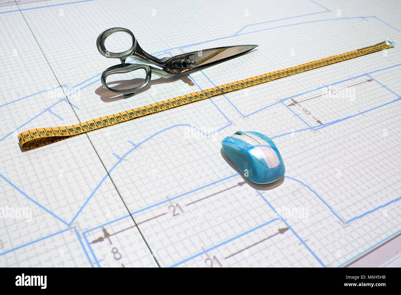 Projection of a pattern for a jacket on paper on a table in a tailors ...