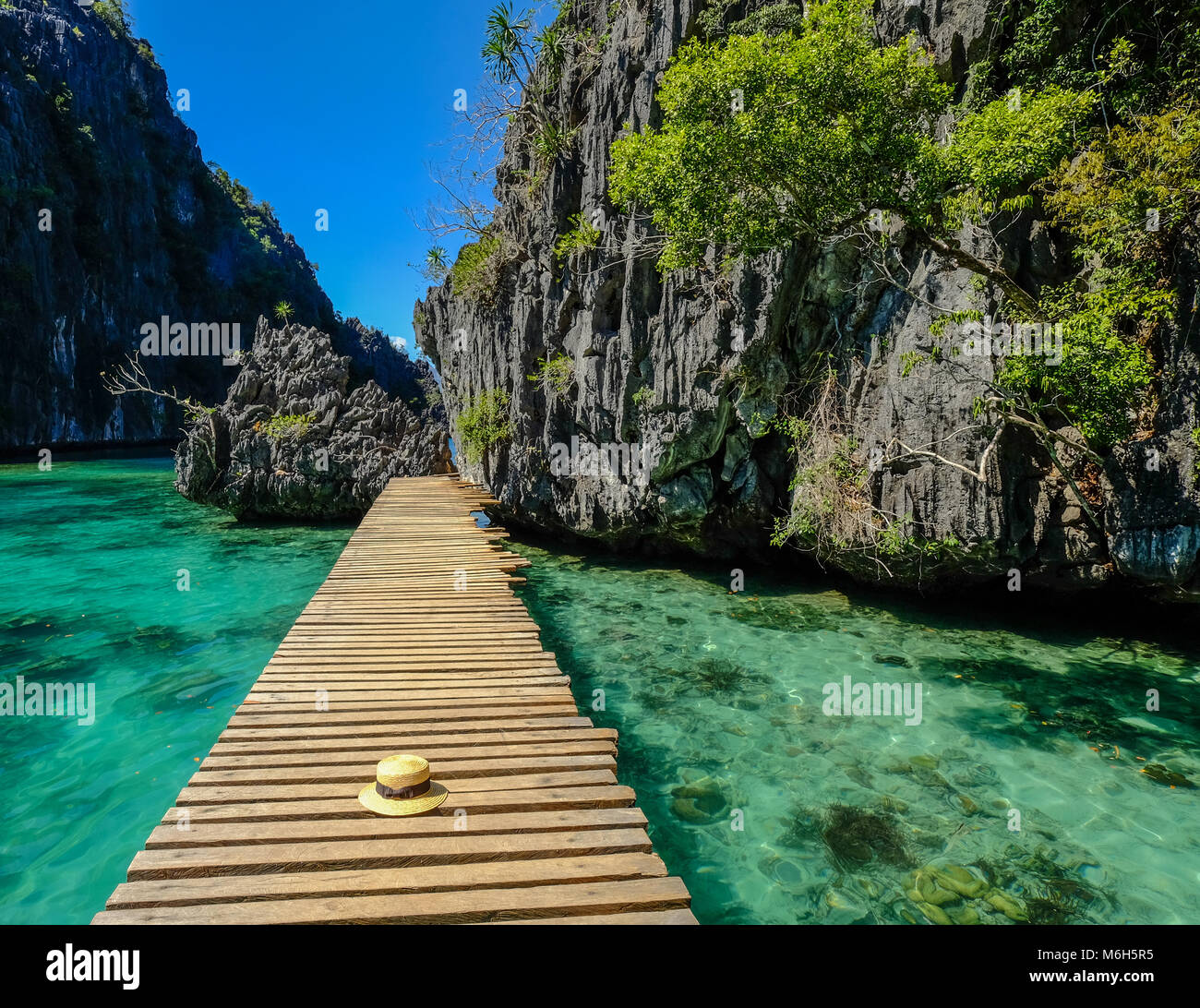 Wooden bridge at sunny day in Palawan, Philippines. Palawan is one of ...