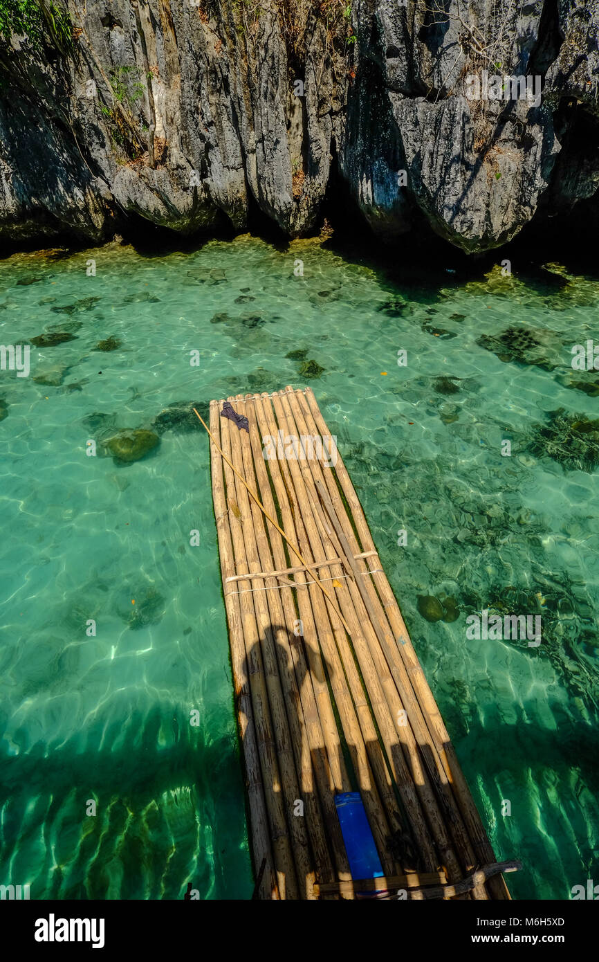 A wooden raft on blue sea in Palawan Island, Philippines Stock Photo ...