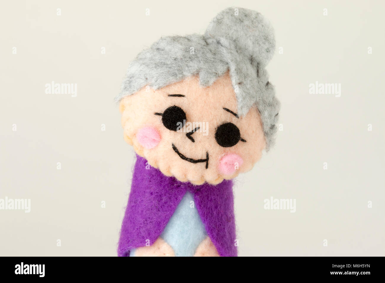 The od lady's puppet with a smiling face Stock Photo - Alamy