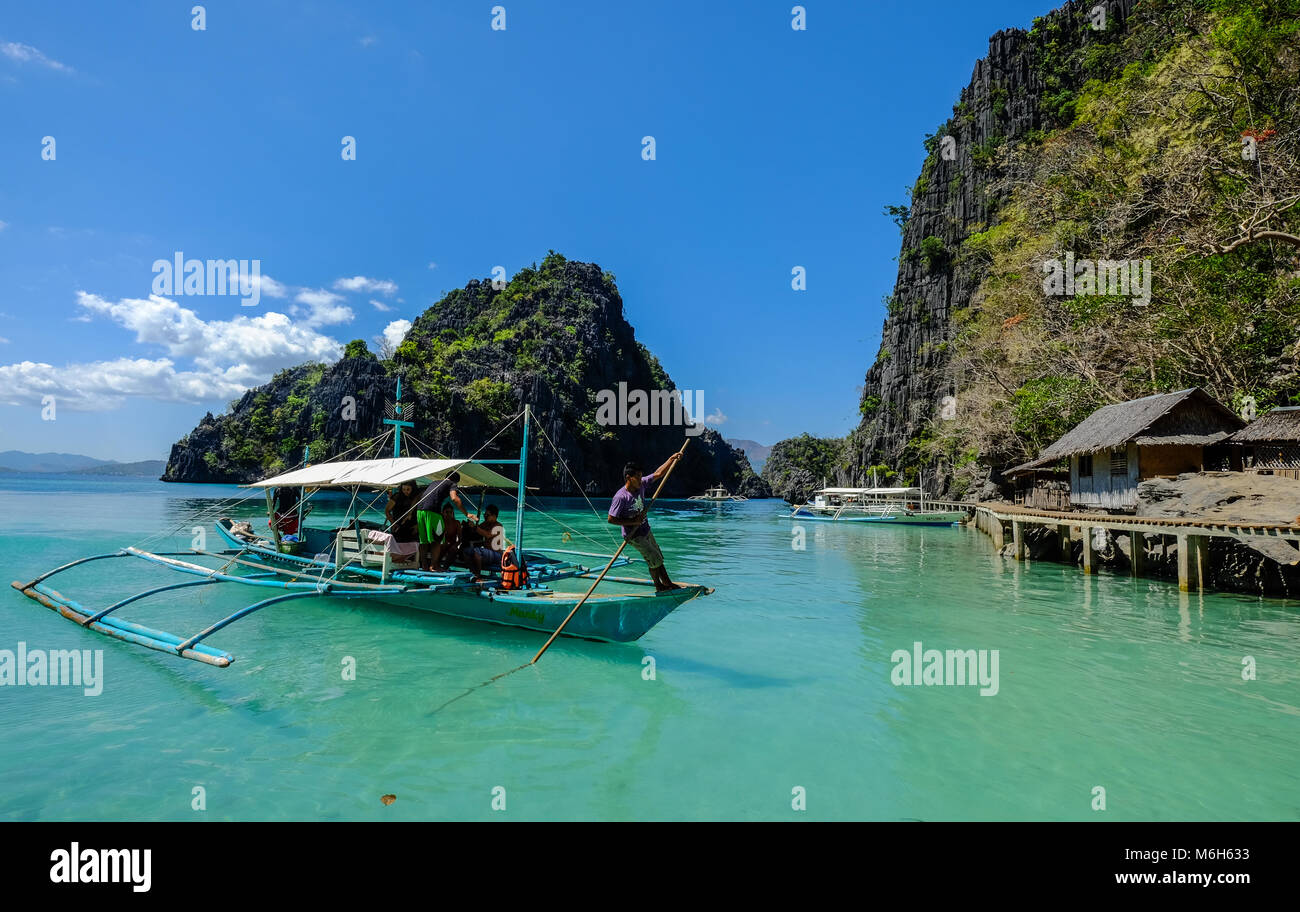 Palawan, Philippines - Apr 11, 2017. A wooden boat coming to pier in ...
