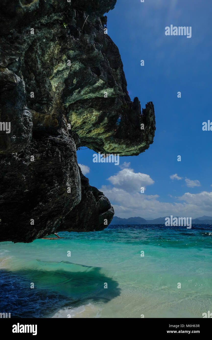 Black rock with beautiful blue sea at summer day in Palawan Island ...