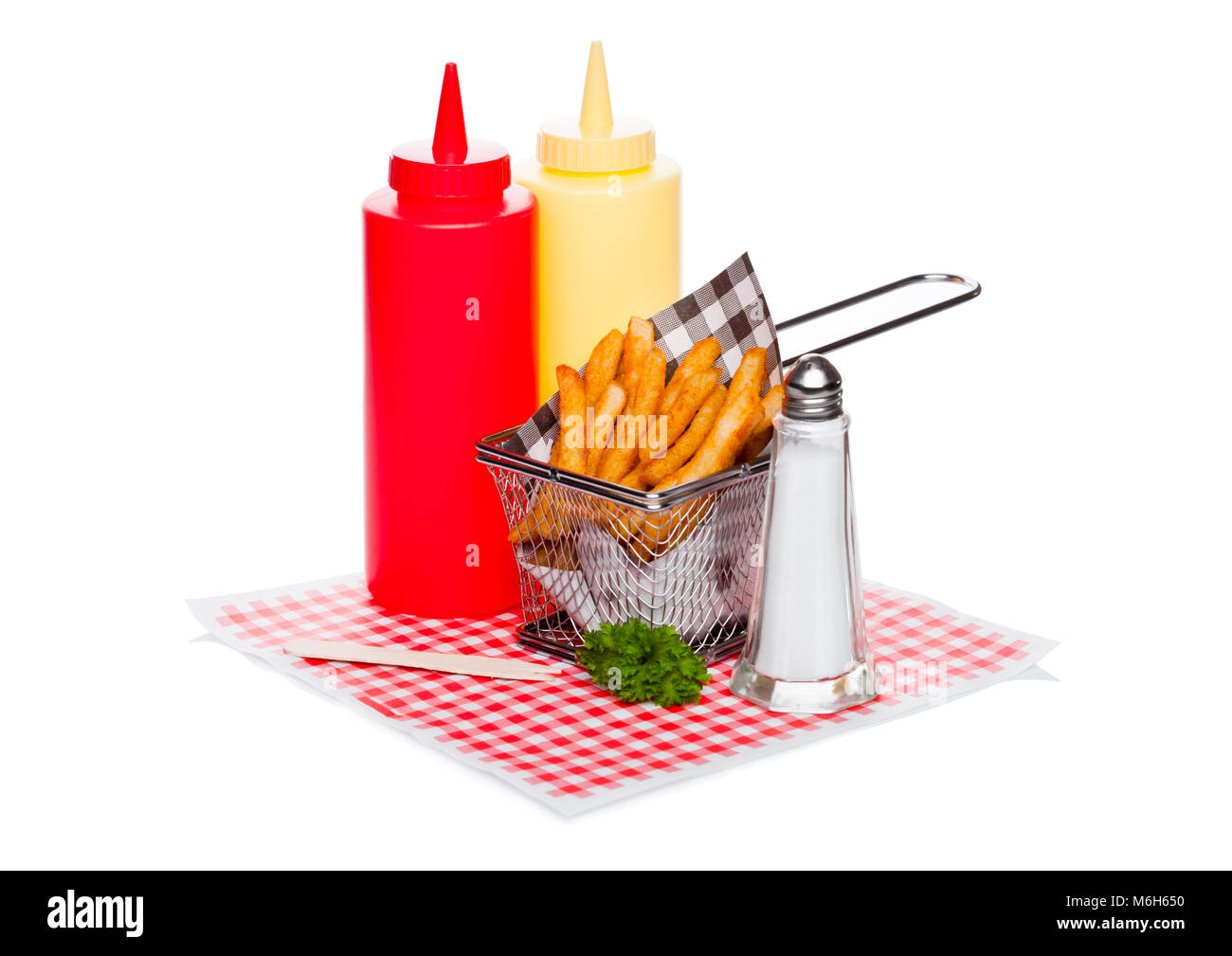 Basket of freshly made southern fries with ketchup and salt black paper ...