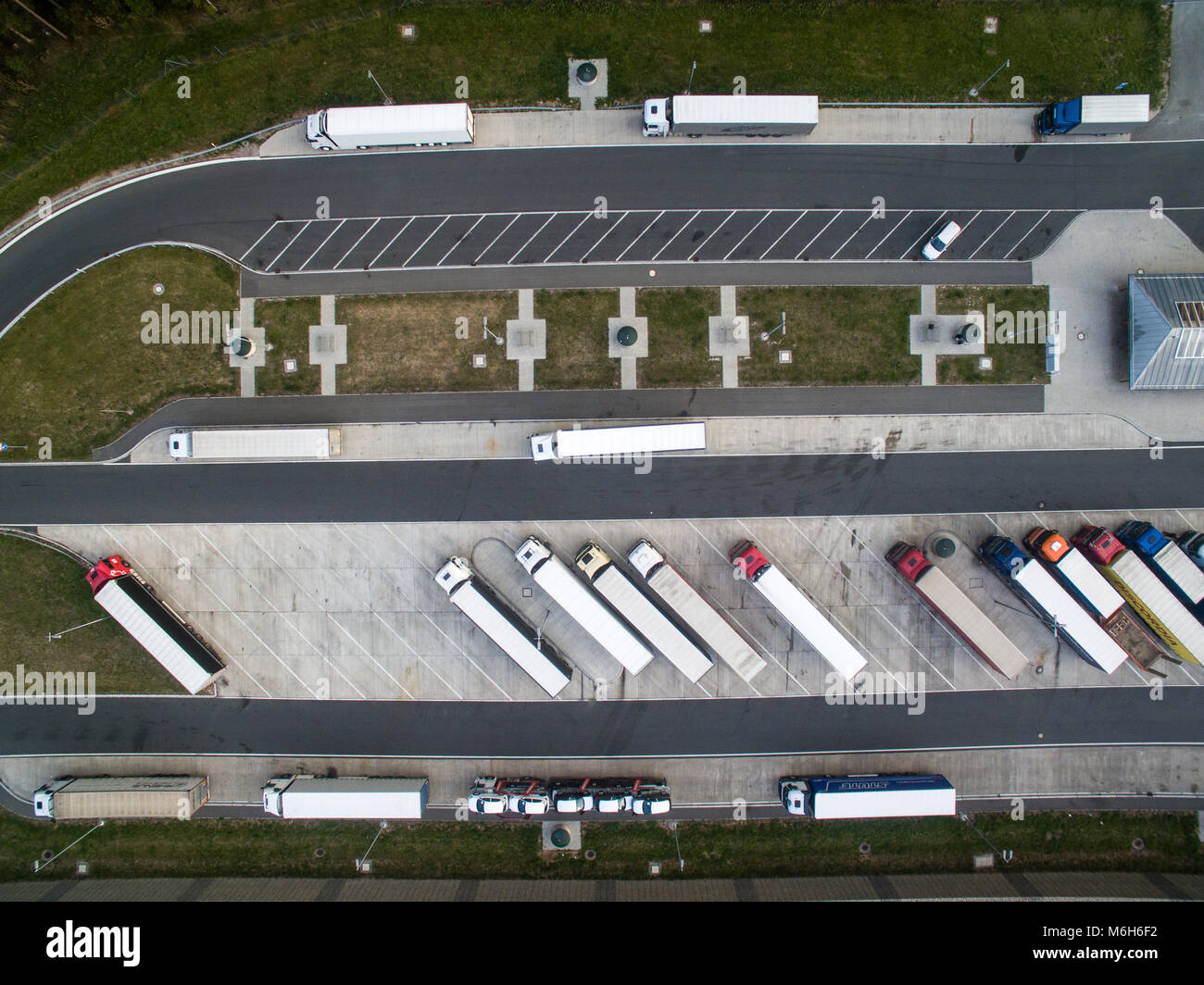 Aerial view of a bus station with cars on it Stock Photo - Alamy