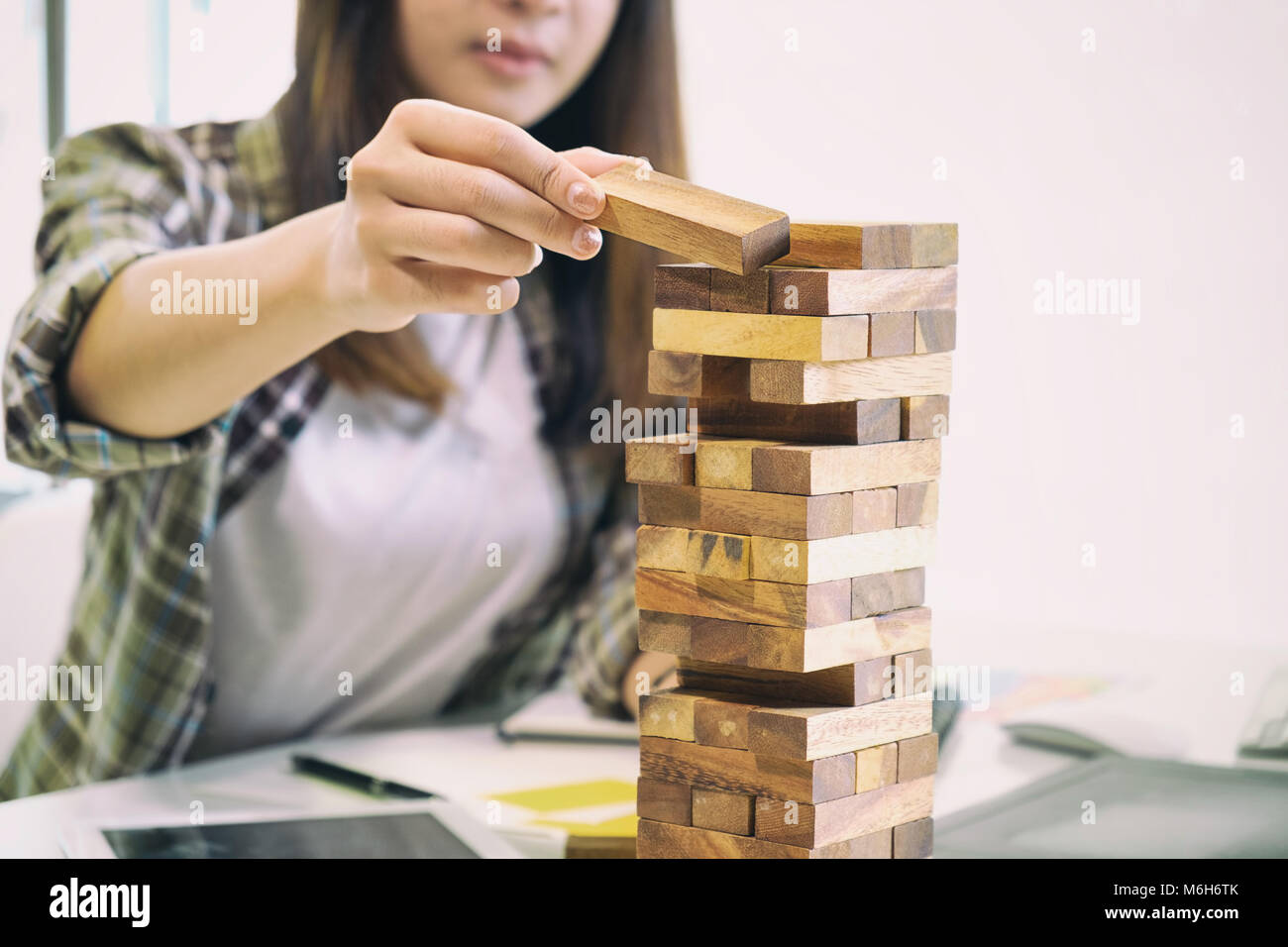 Young architecture visual construction building tower on wood block ...