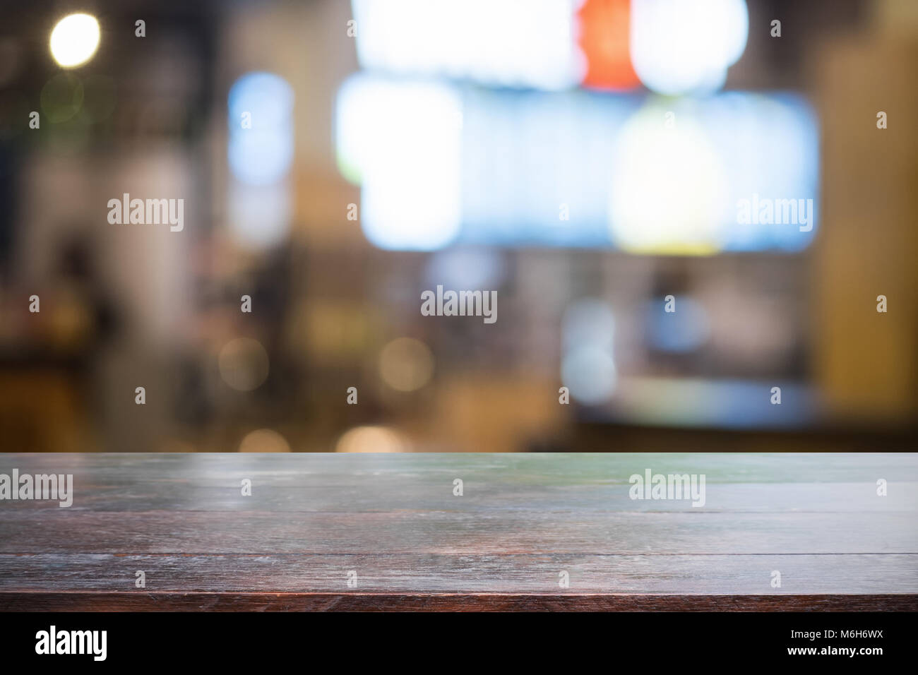 Empty wood table with night cafe blur background Stock Photo - Alamy