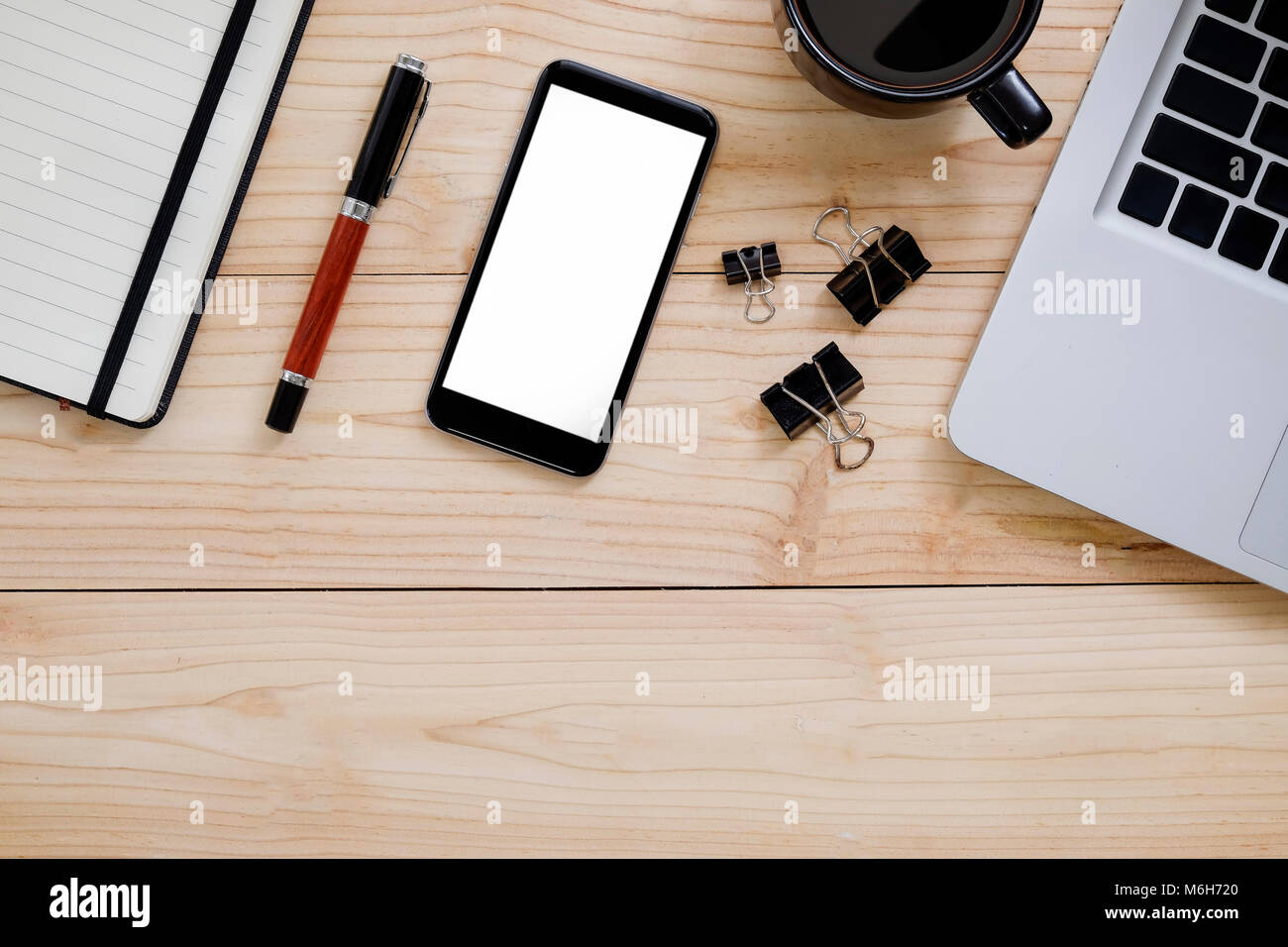 Empty screen smartphone and office supplies on wood work table Stock ...