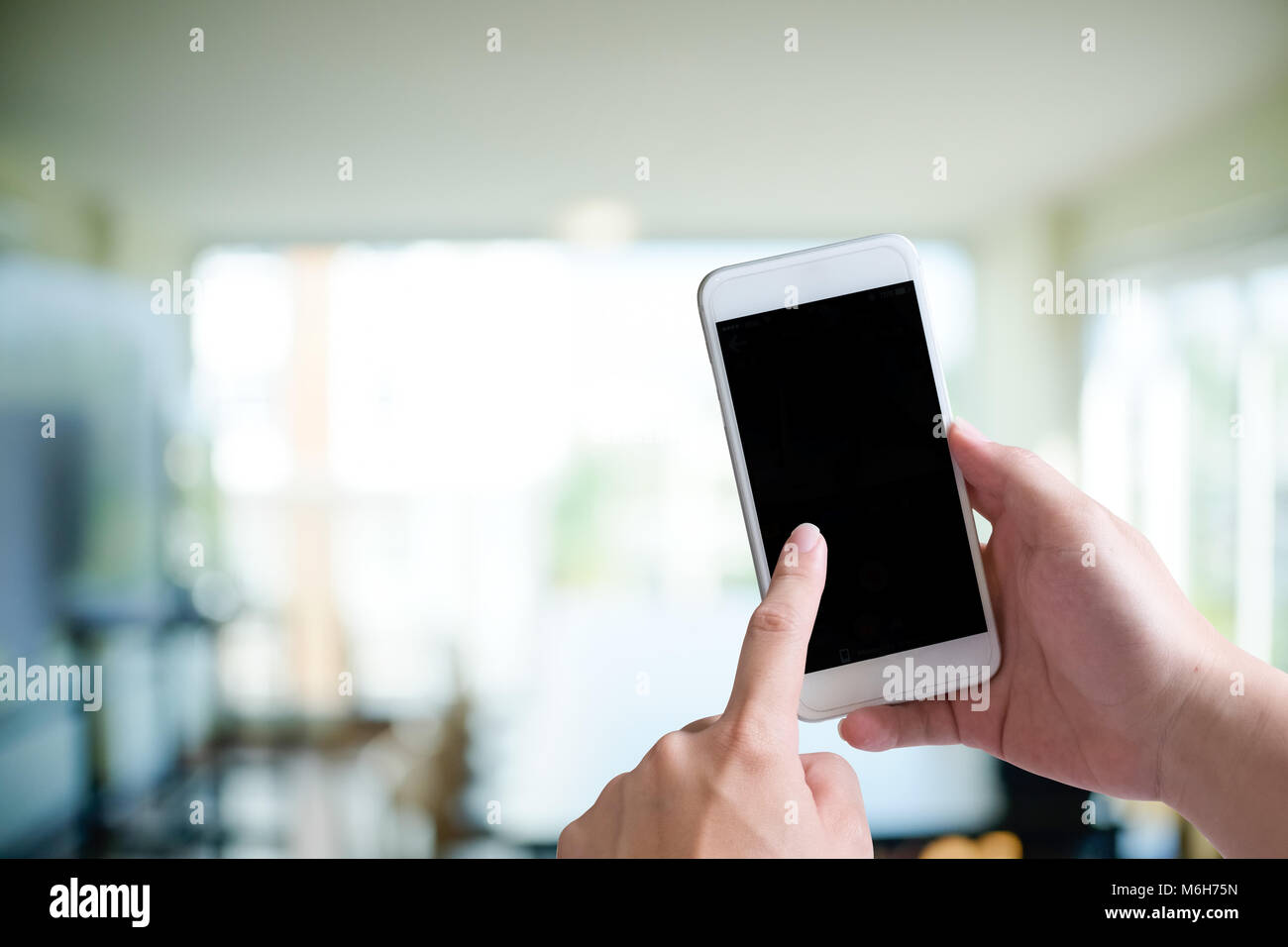 Cropped shot of hand touch smartphone with empty screen Stock Photo - Alamy
