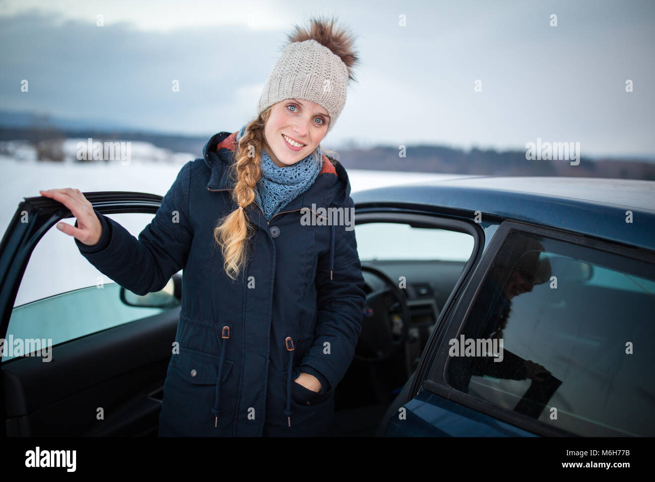 Woman driving a car - female driver at a wheel of a modern car, looking ...