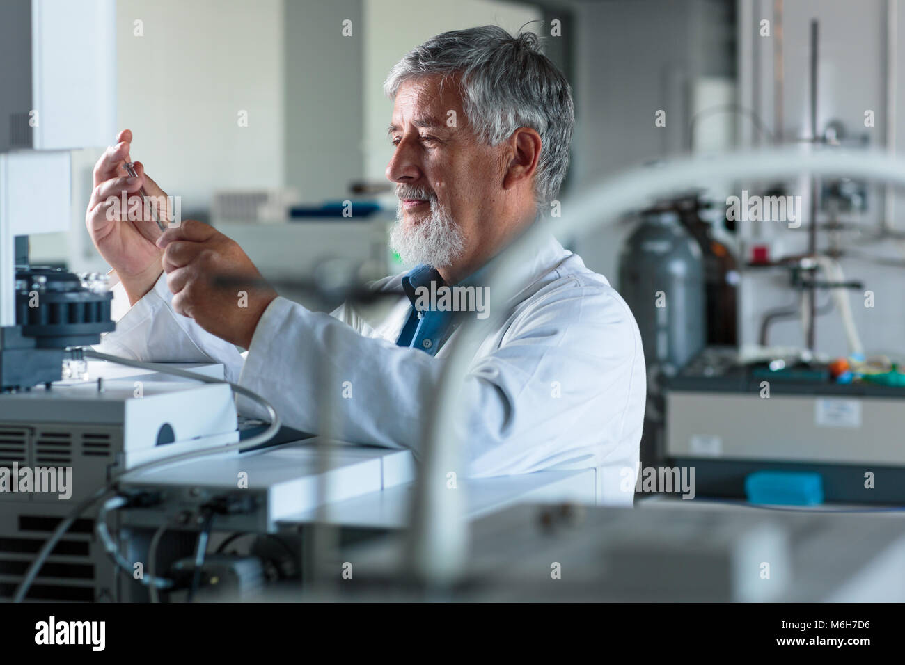 Senior chemistry professor/doctor in a lab (color toned image Stock ...