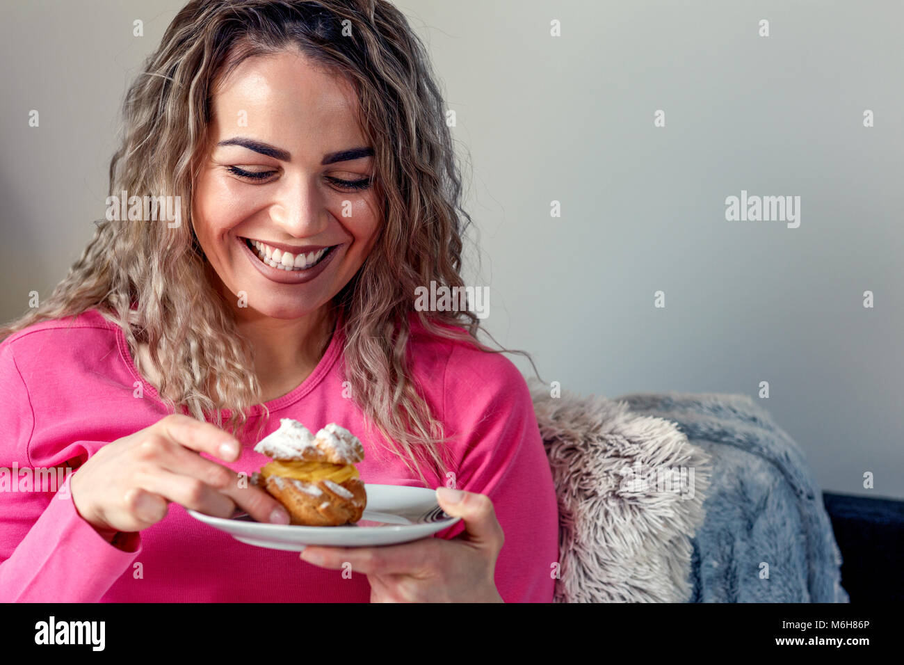Woman alone eating cookies hi-res stock photography and images - Alamy