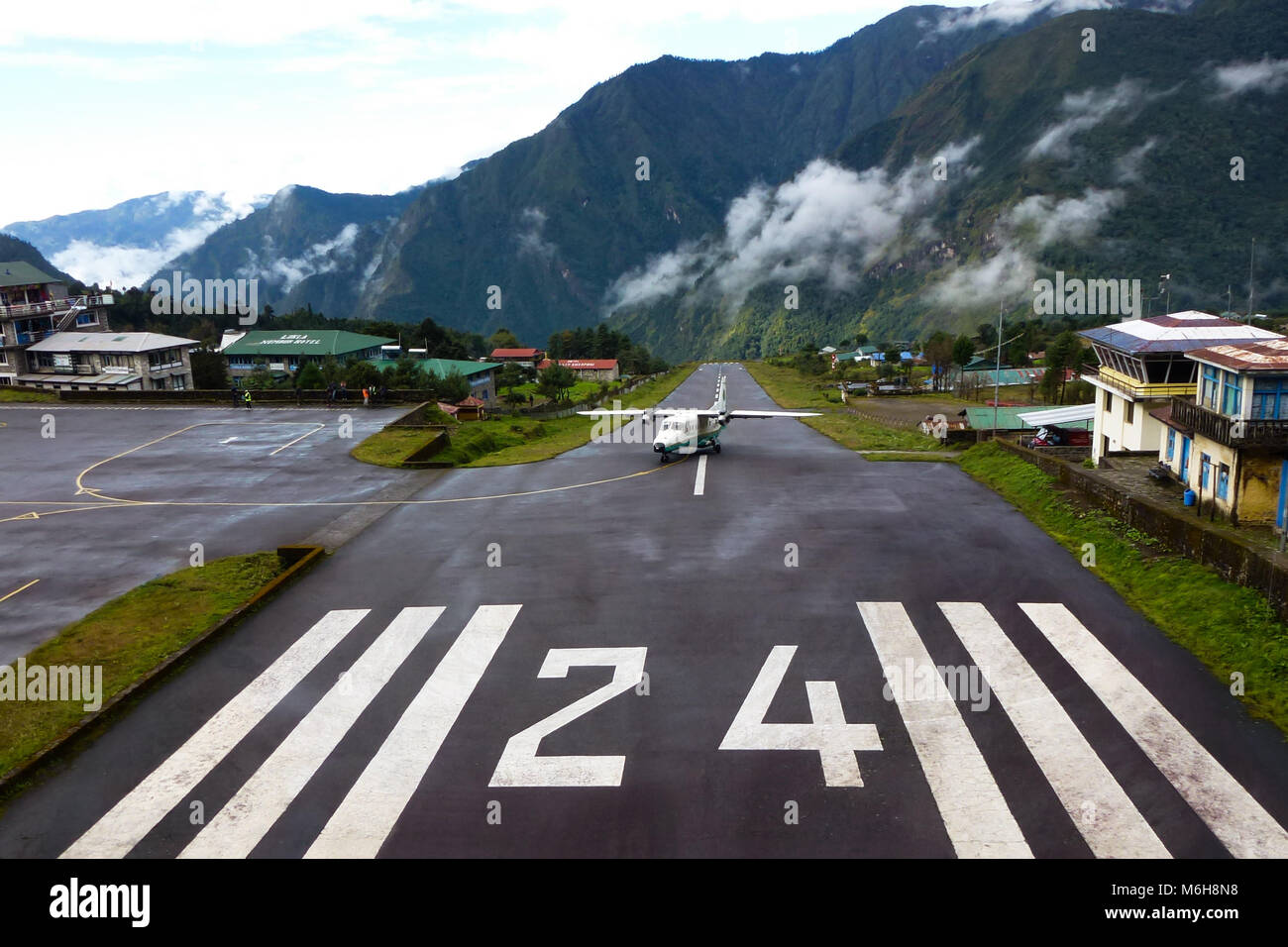 Small plane landing at the "Tenzing-Hillary" Airport in Lukla on a ...