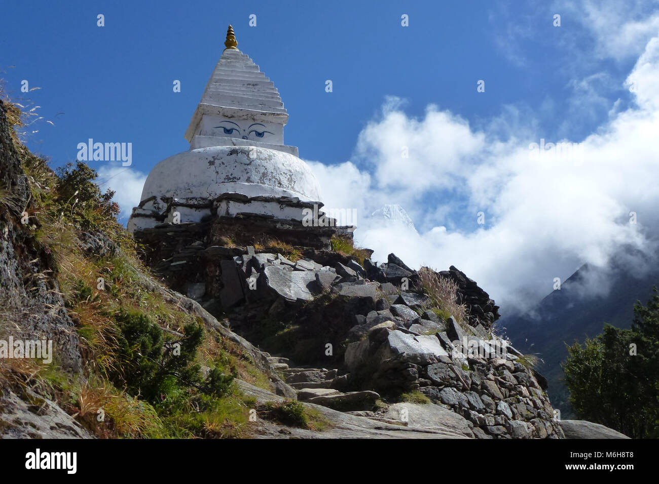 Picture of a stupa (shrine) over a blue sky with clouds, Pangboche ...