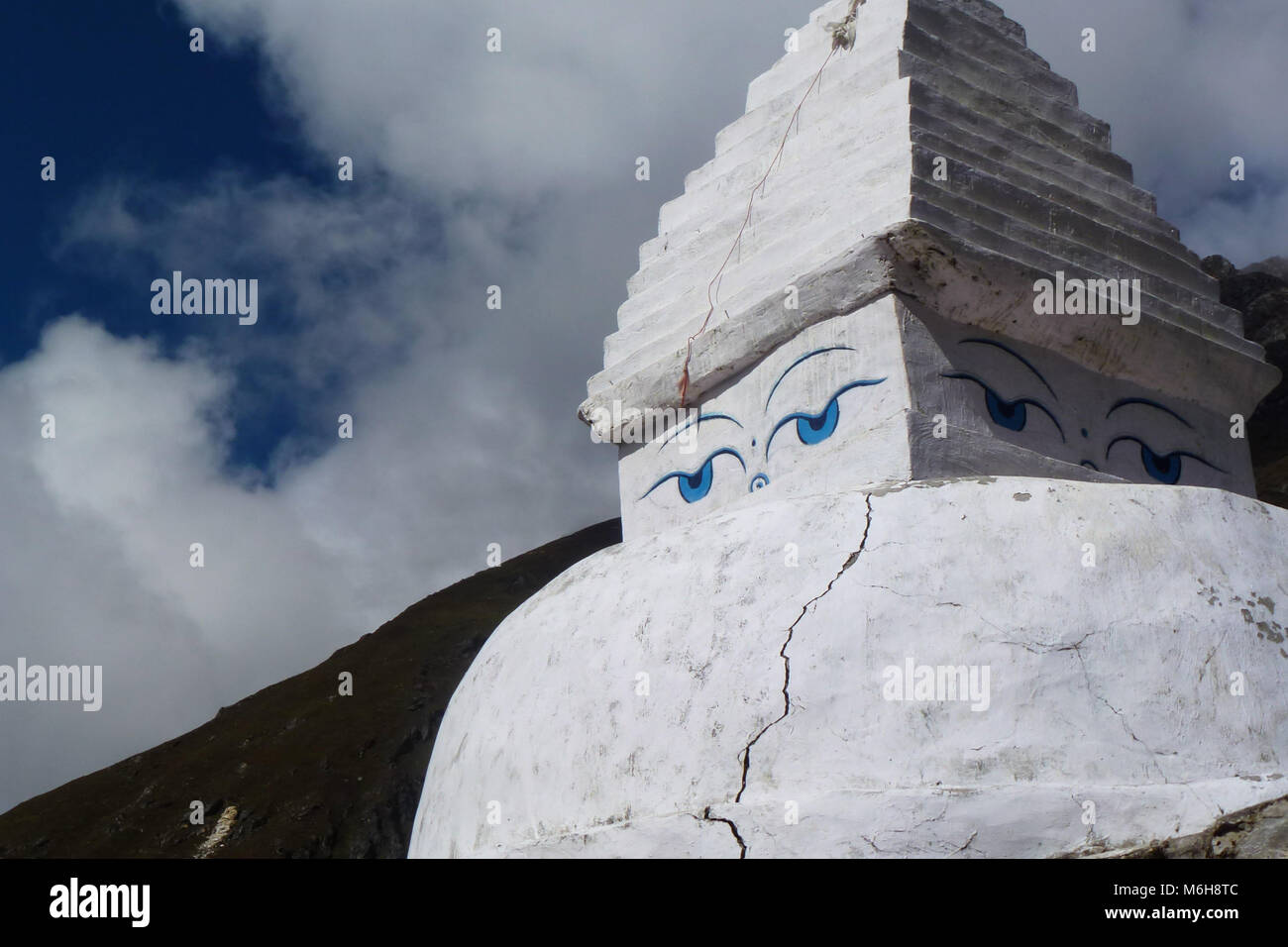 Picture of a stupa (shrine) over a blue sky with clouds, Pangboche ...