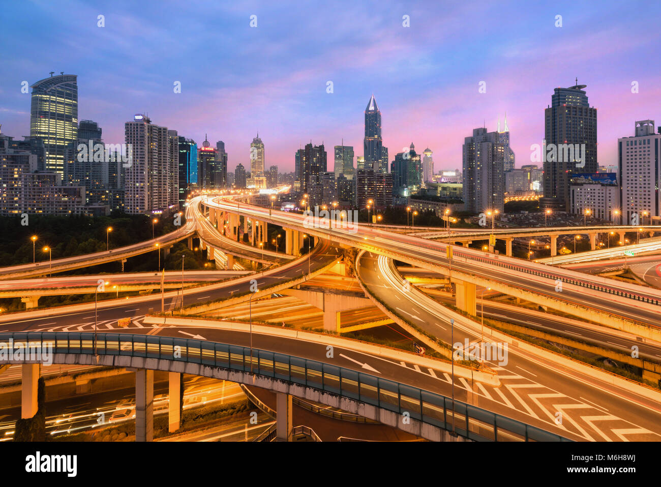 Beautiful Shanghai city with interchange overpass at nightfall in ...
