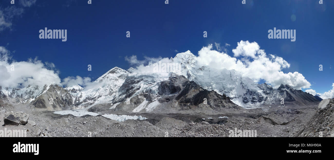 Panoramic view of the himalayan Everest Range with blue sky and clouds ...
